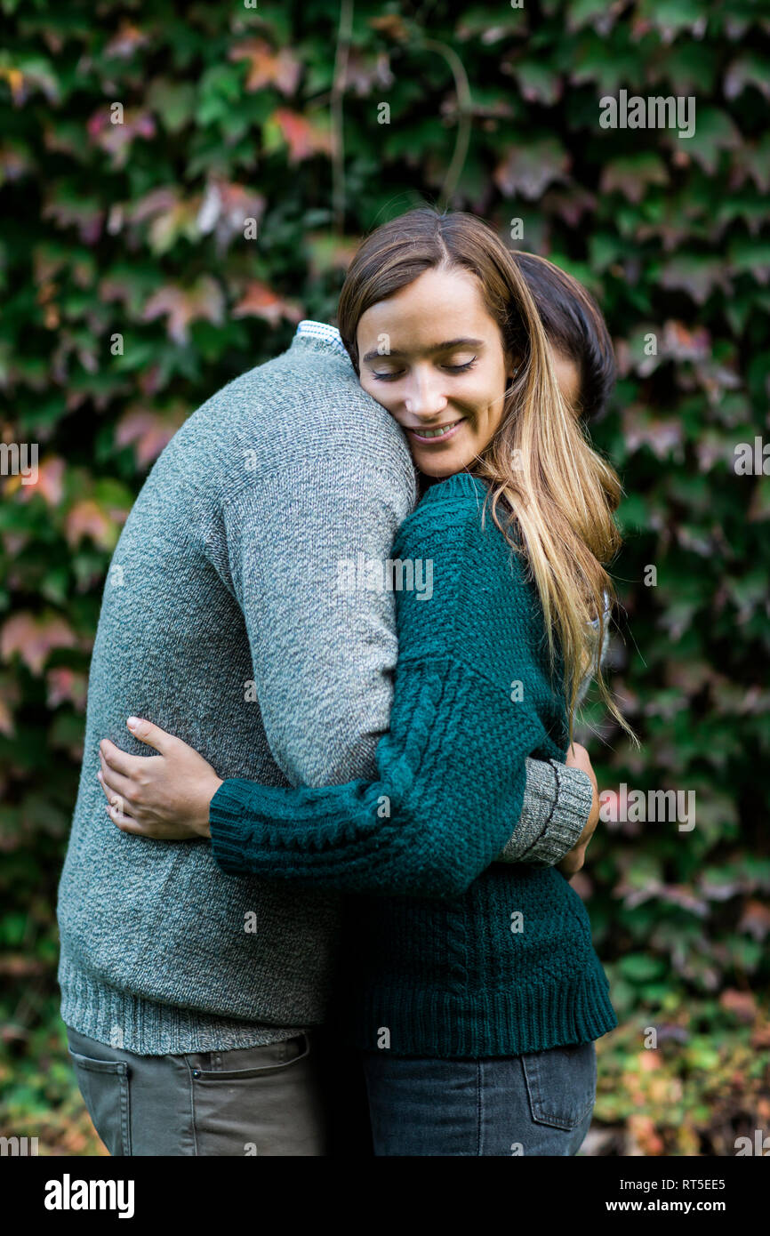 Happy affectionate couple hugging outdoors Stock Photo - Alamy
