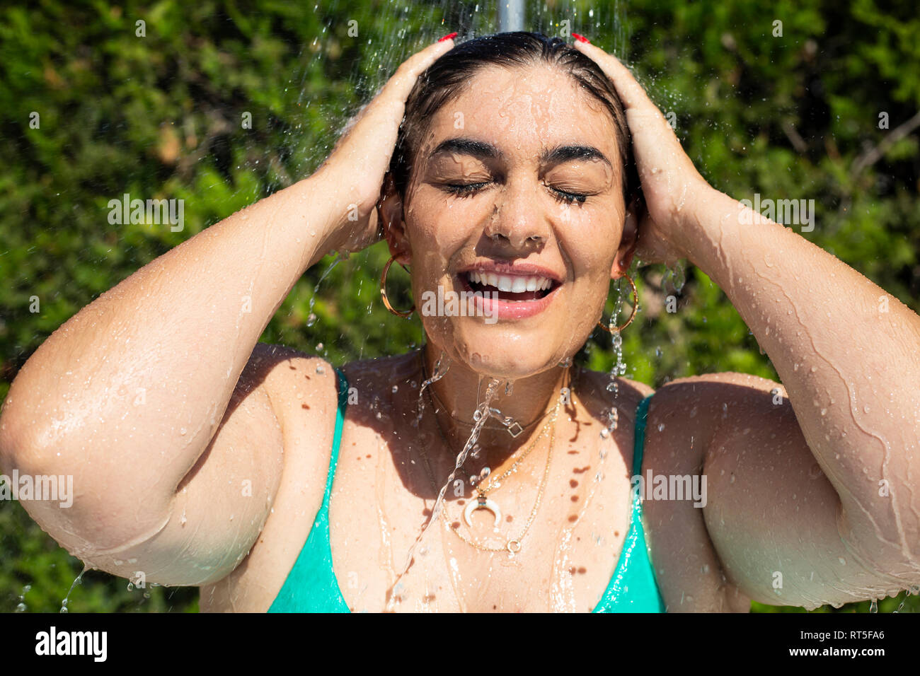 Woman taking shower outdoors hi-res stock photography and images - Alamy
