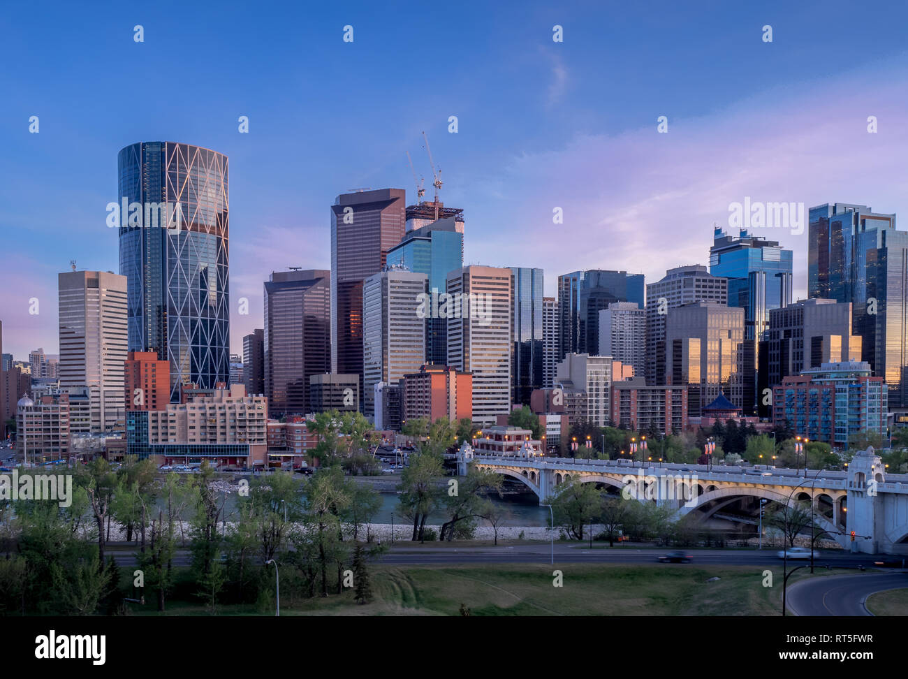 Calgary skyline at night with Bow River and Centre Street Bridge ...
