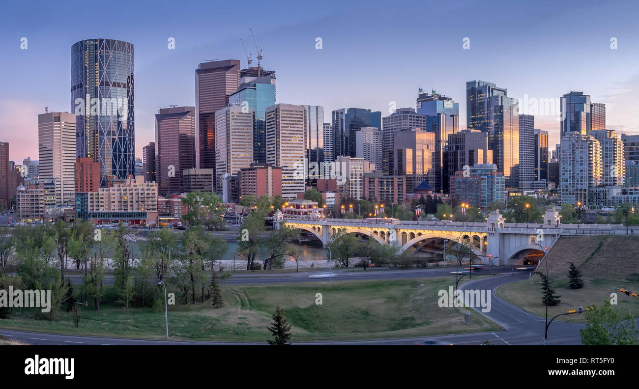 Calgary skyline at night with Bow River and Centre Street Bridge ...