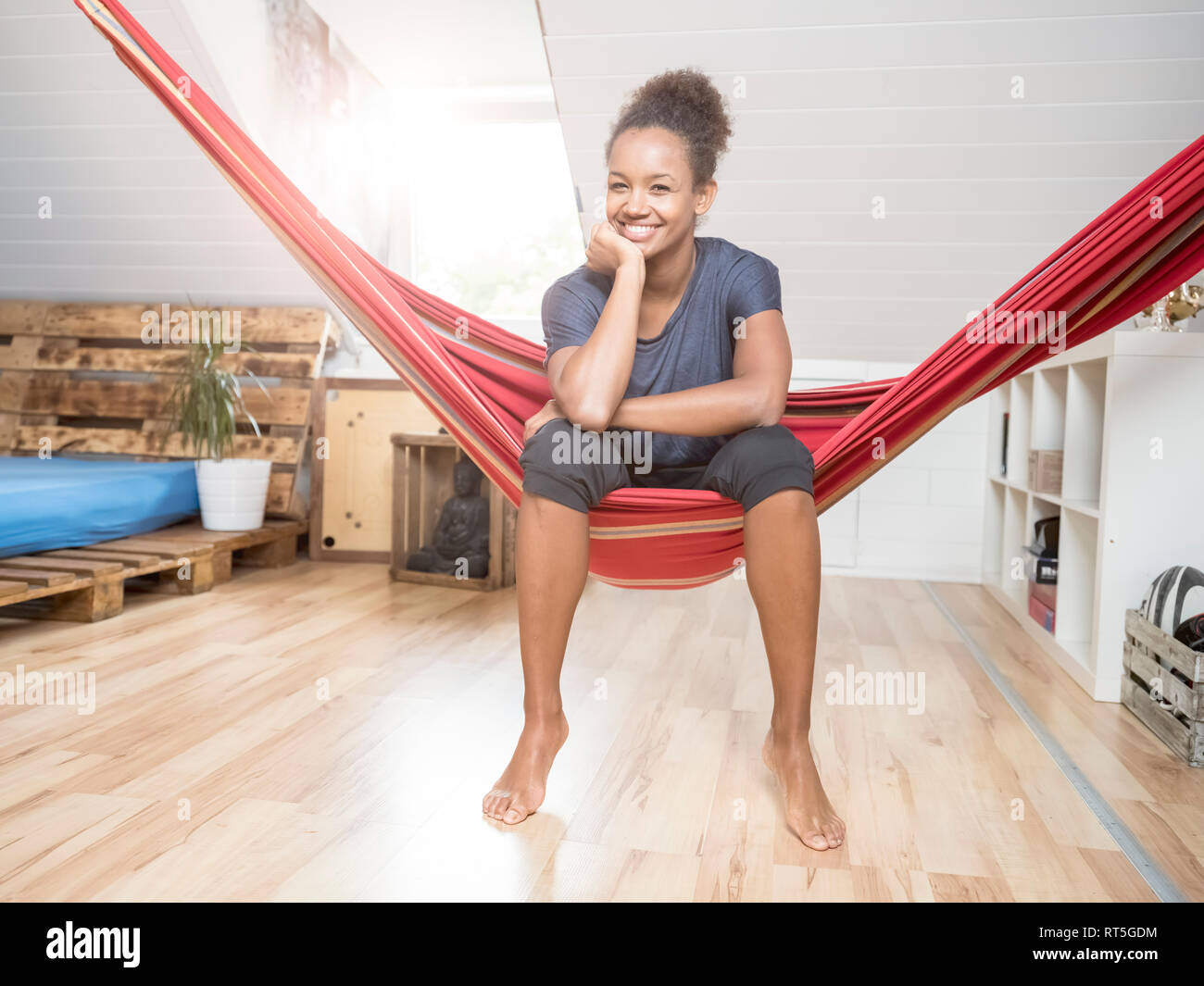 Woman resting in hammock enjoying hi-res stock photography and images ...