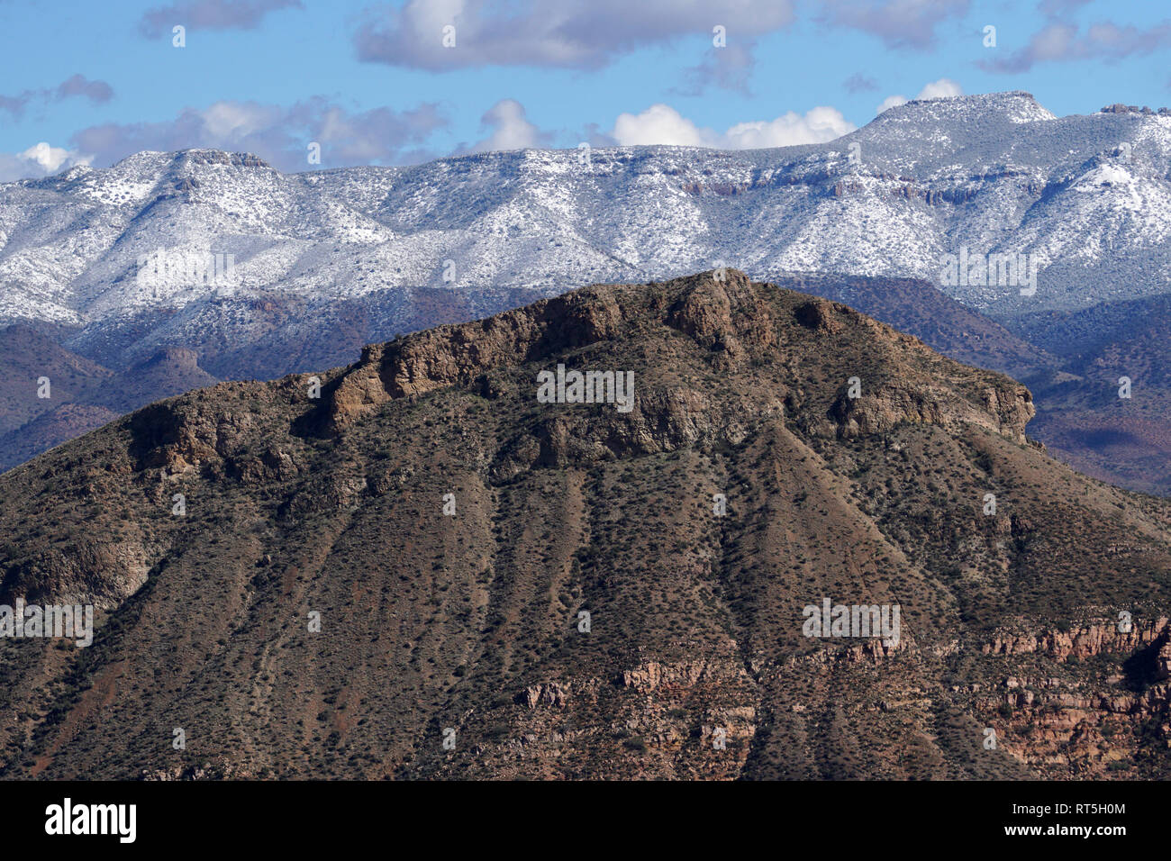 A winter storm brings snow to the Four Peaks Mountain Range as seen ...