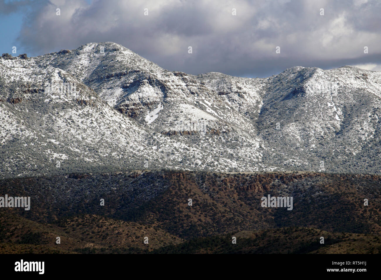 A winter storm brings snow to the Four Peaks Mountain Range as seen ...
