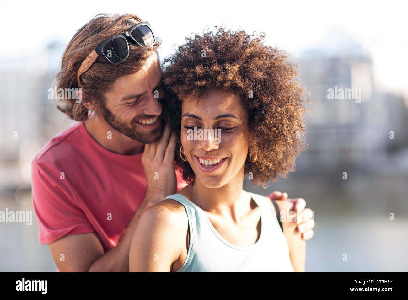 Man whispering in womans ear hi-res stock photography and images - Alamy