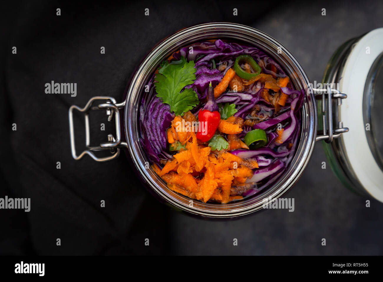 Homemade red cabbage, fermented, with chili, carrot and coriander, in a ...