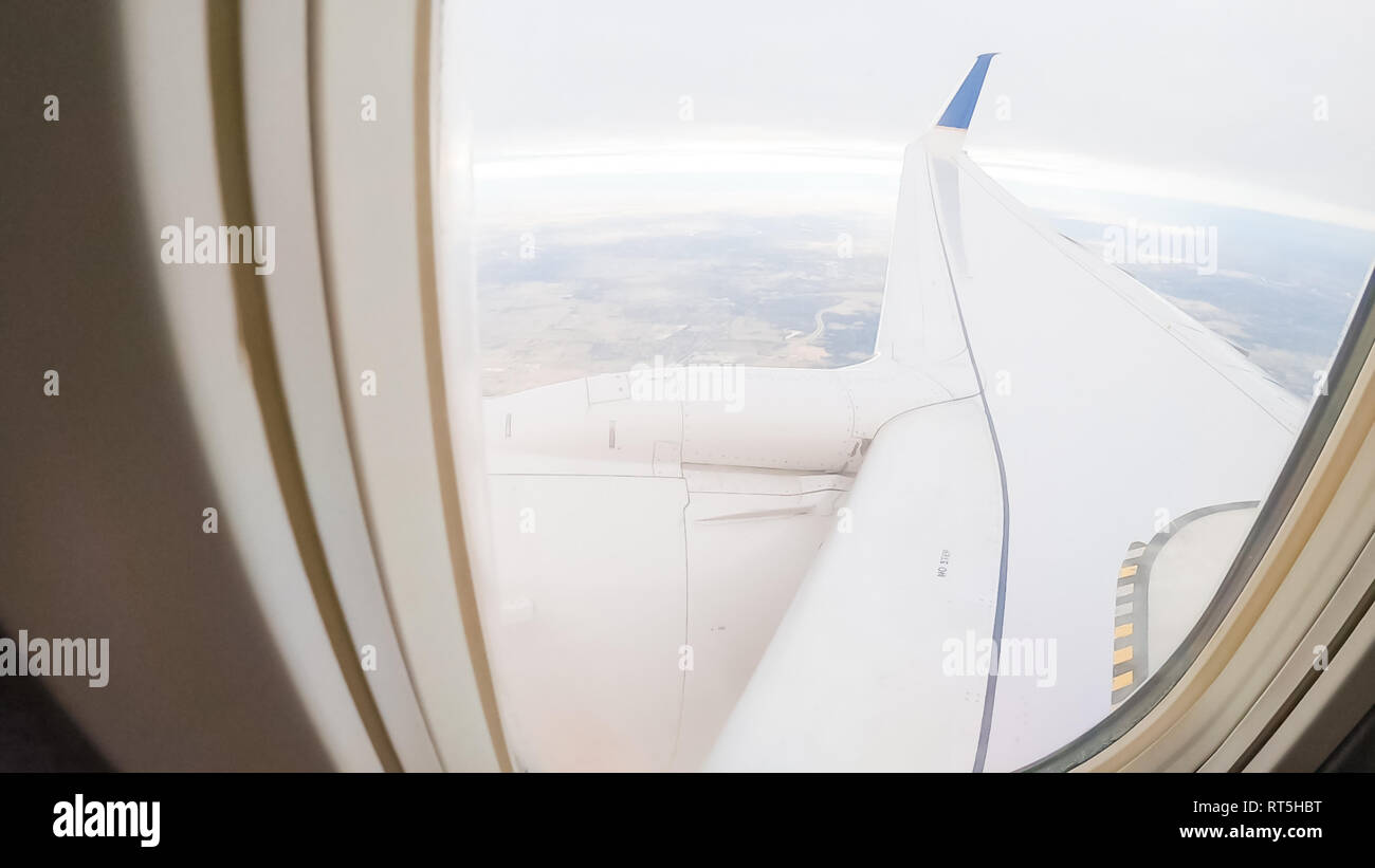 View from the window seat of commercial passenger airplane Stock Photo ...