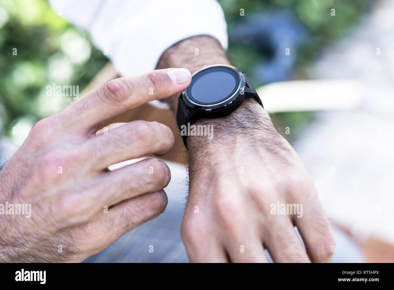Man using smartwatch hi-res stock photography and images - Alamy