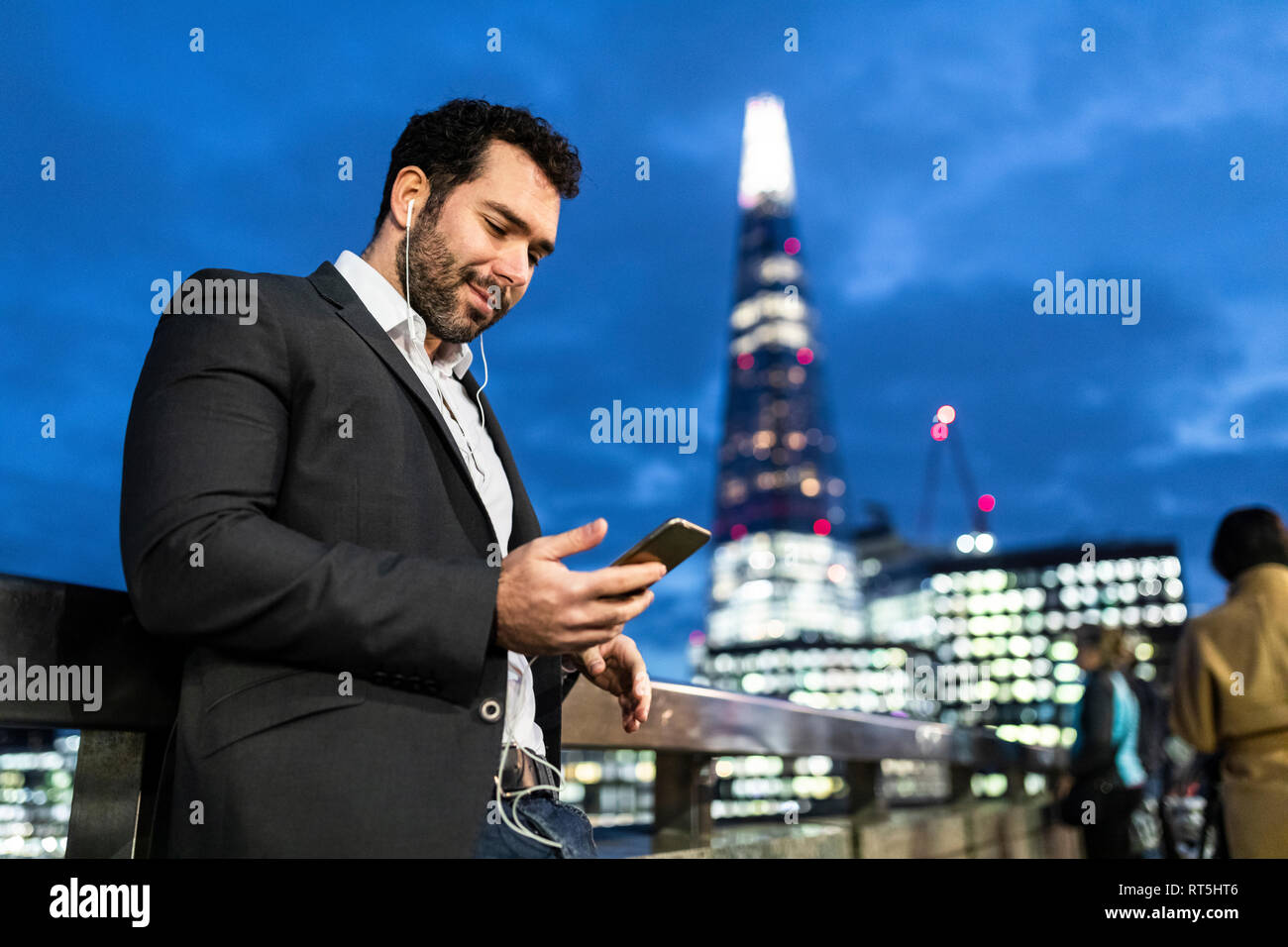 Man Commuting Night City Looking Phone High Resolution Stock ...