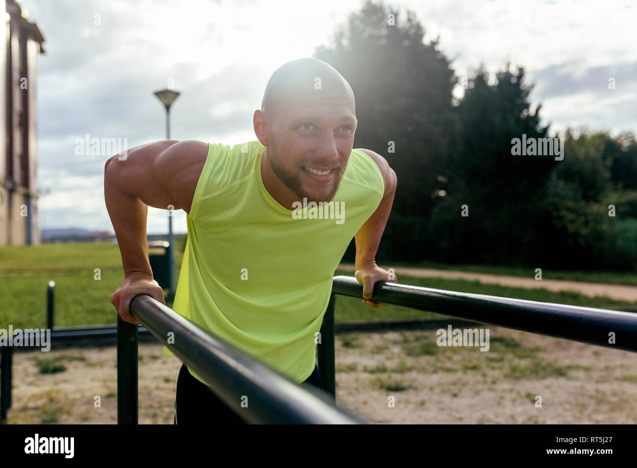 Muscular man exercising outdoors Stock Photo - Alamy