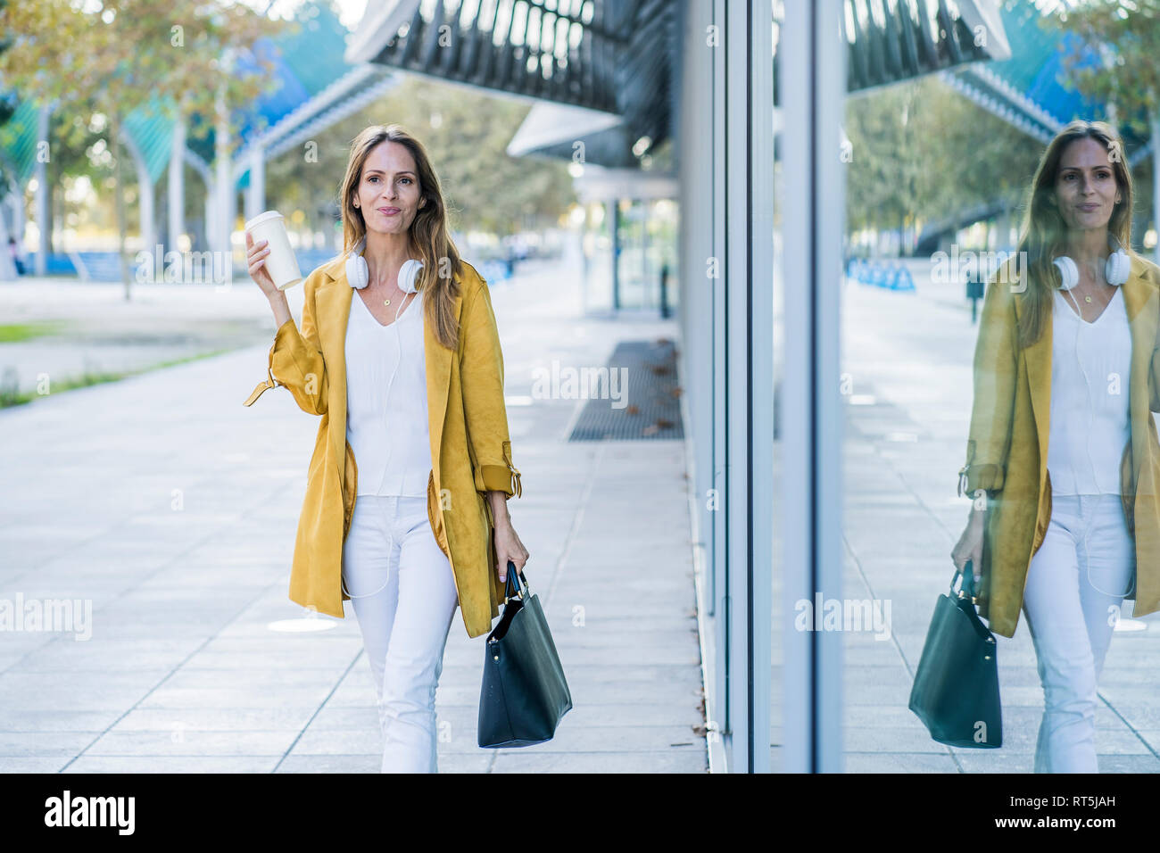 Woman walking with handbags hi-res stock photography and images - Alamy