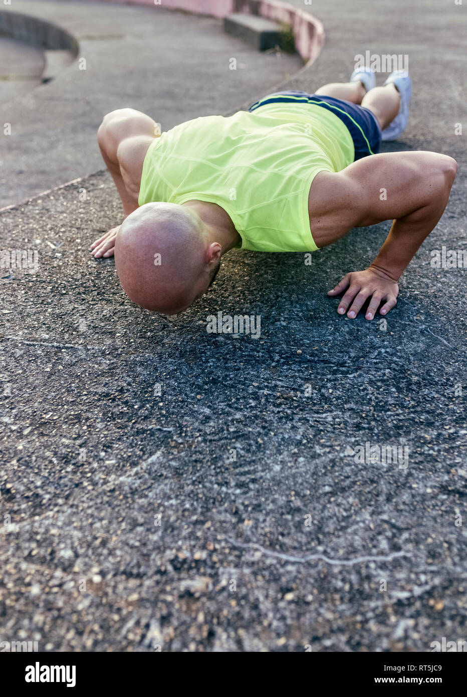 Muscular man doing push-ups outdoors Stock Photo - Alamy