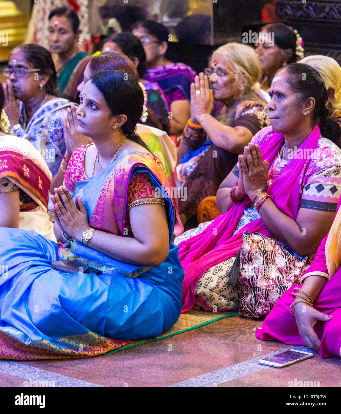 Indian women praying at sri mariamman hi-res stock photography and ...