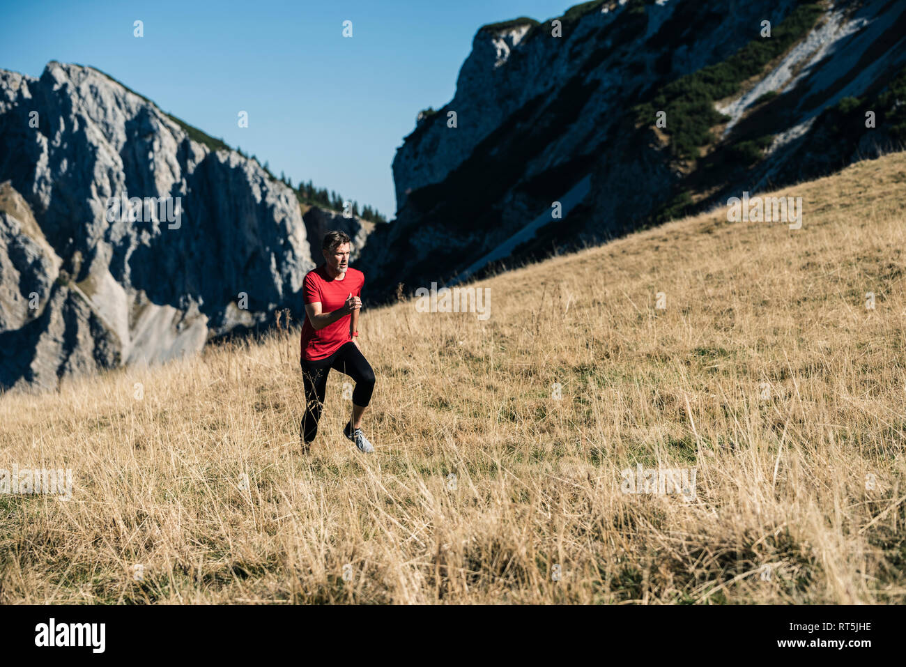 Austria, Tyrol, man running in the mountains Stock Photo - Alamy