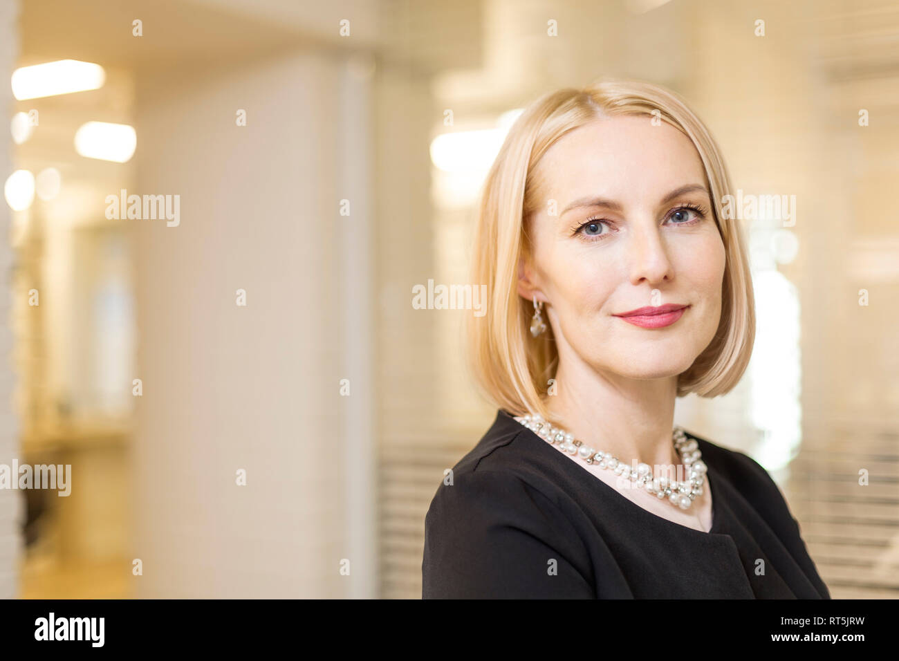 Portrait of content beauty salon owner Stock Photo - Alamy