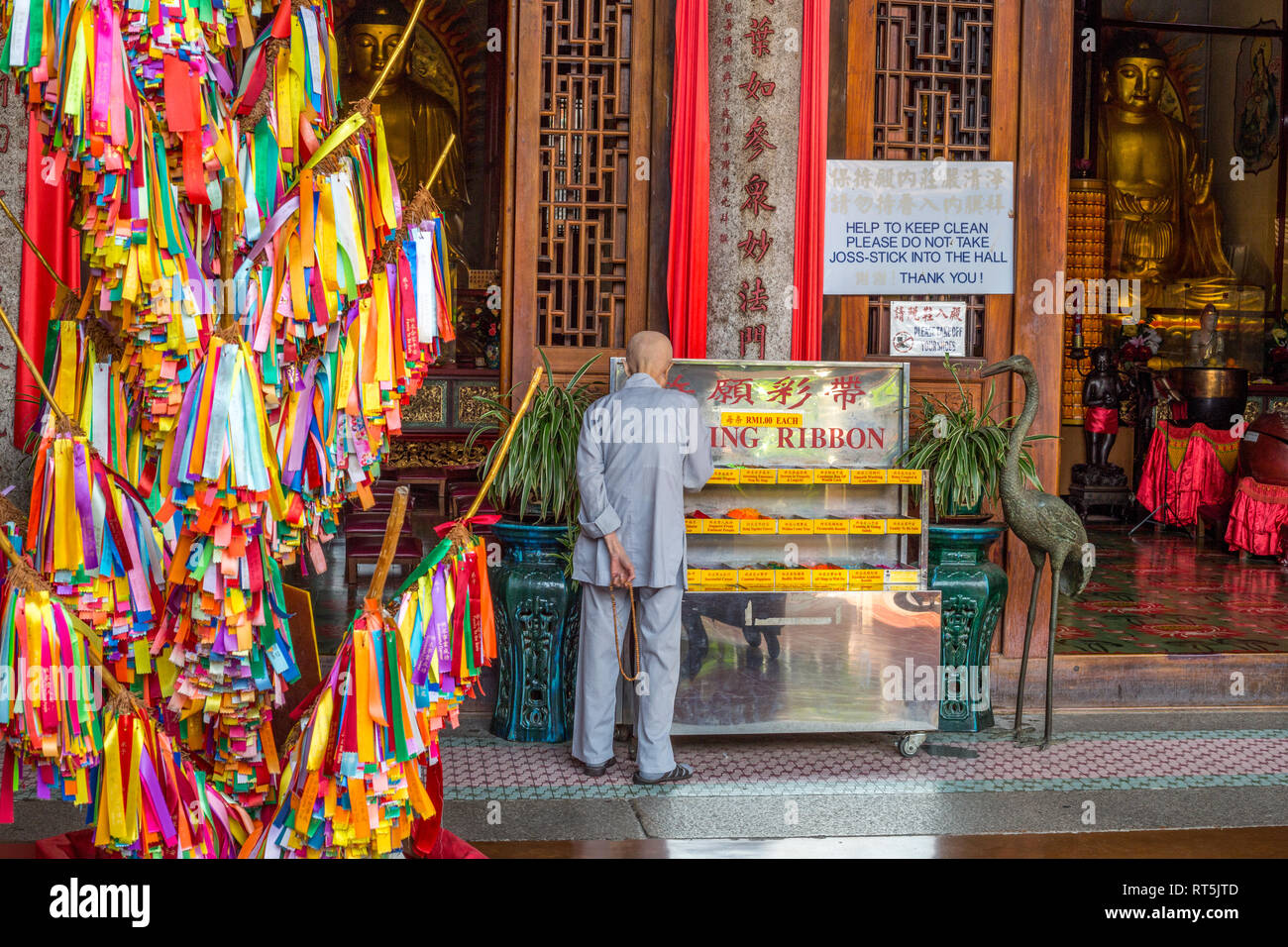 Kek Lok Si Buddhist Temple, Man Examining Wishing Ribbons for Good Luck ...