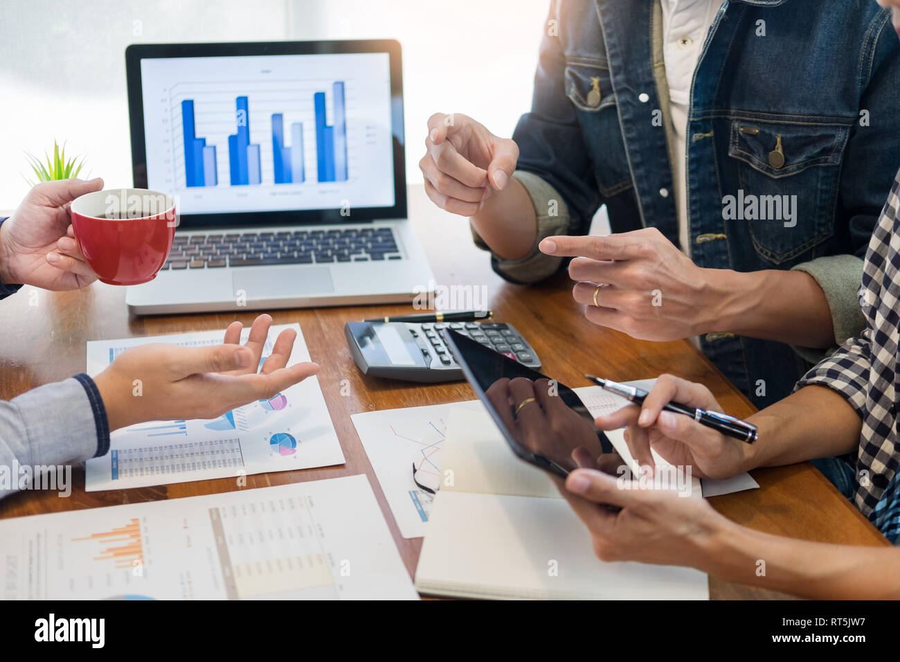 Business creative coworkers team Meeting Discussing showing the results ...