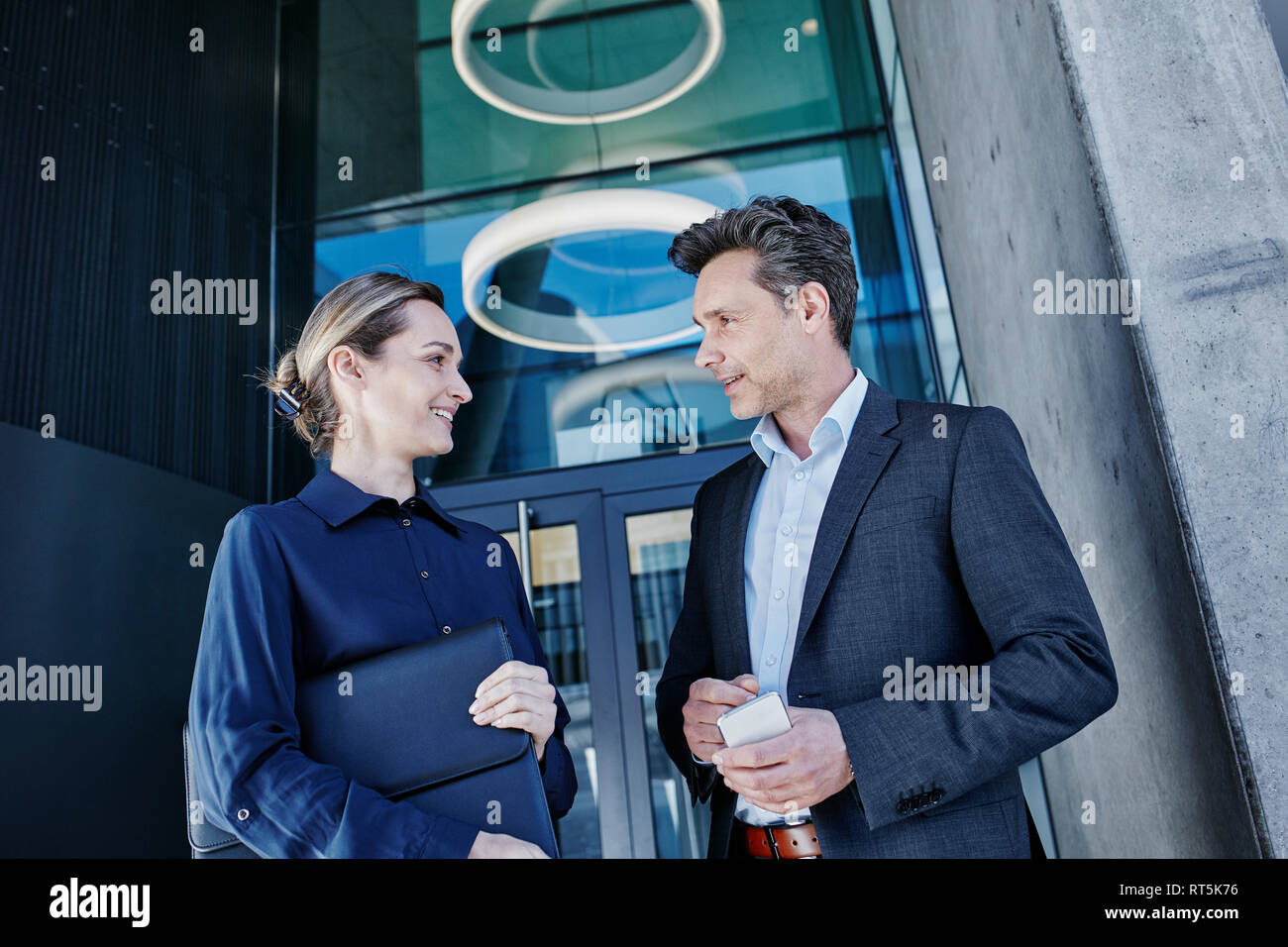 Two business partners communicating Stock Photo - Alamy