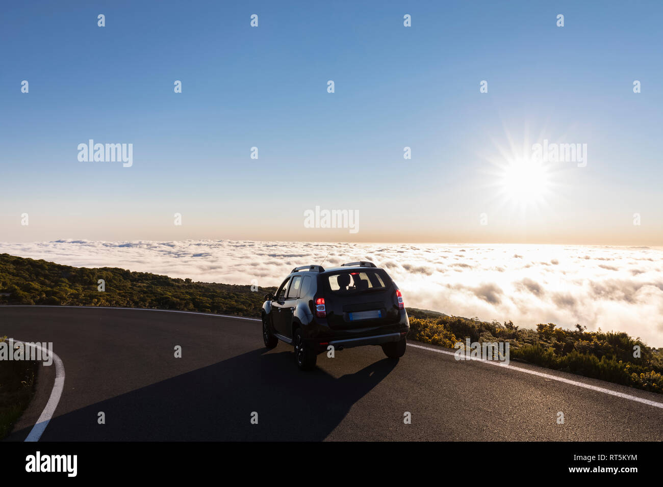 Reunion, Reunion National Park, car on the road to Maido viewpoint, sea ...
