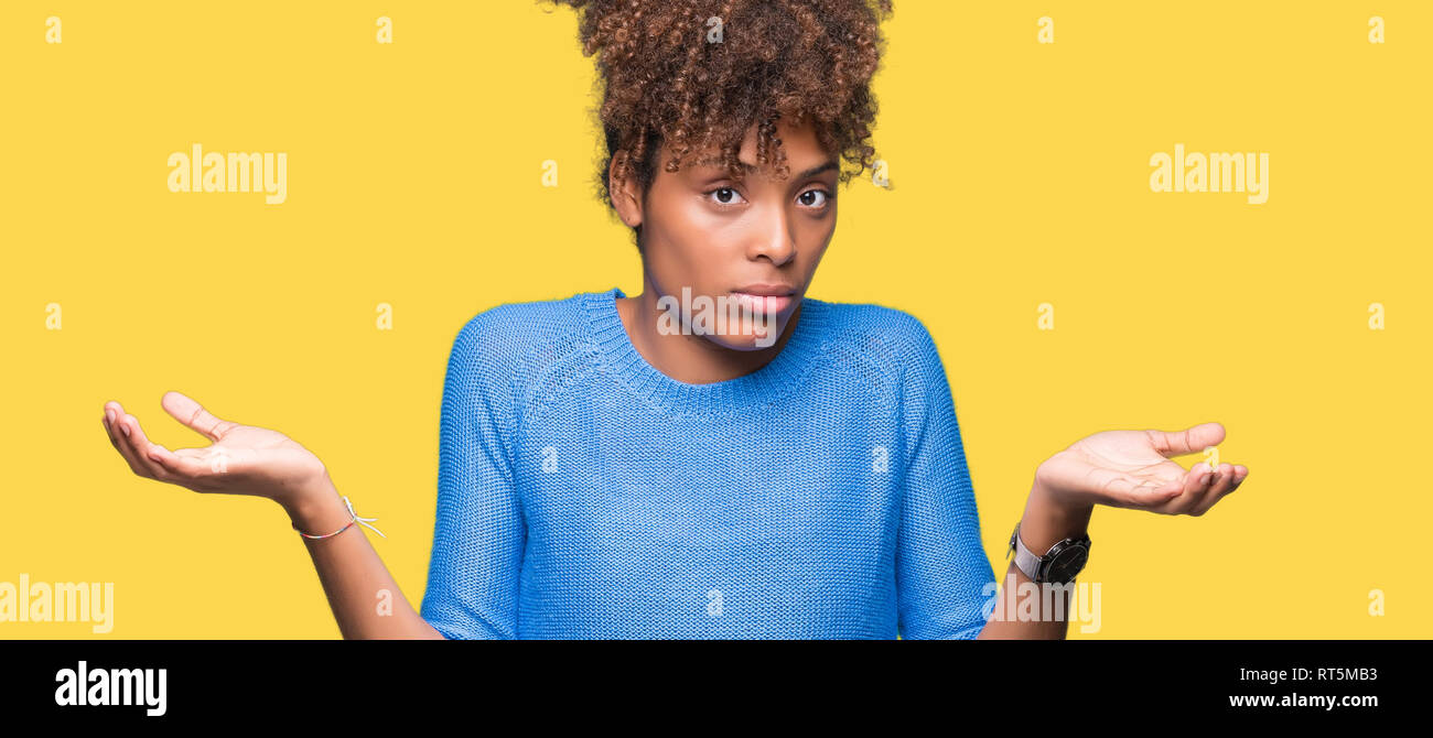 Beautiful young african american woman over isolated background ...