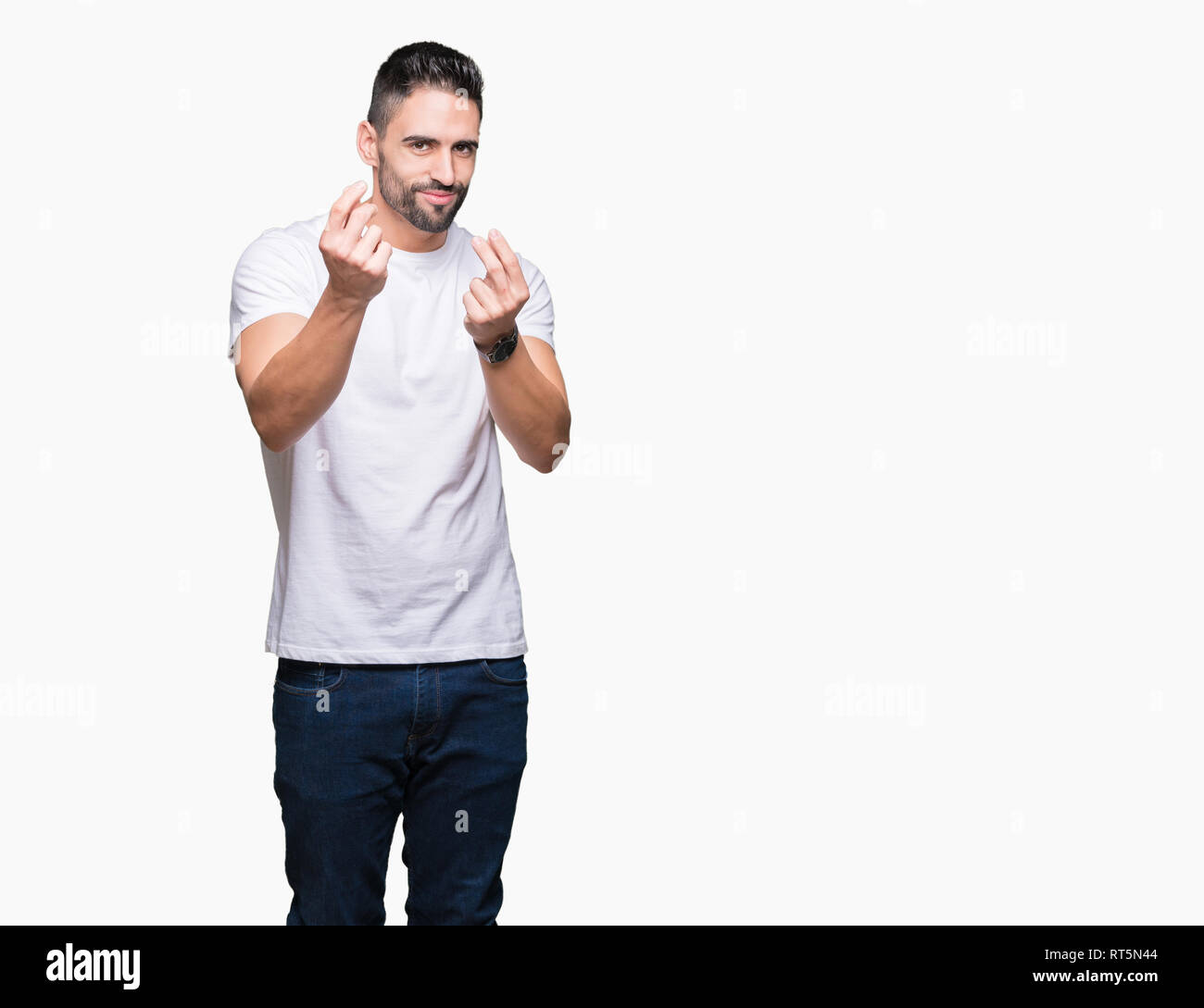 Handsome man wearing white t-shirt over white isolated background Doing ...