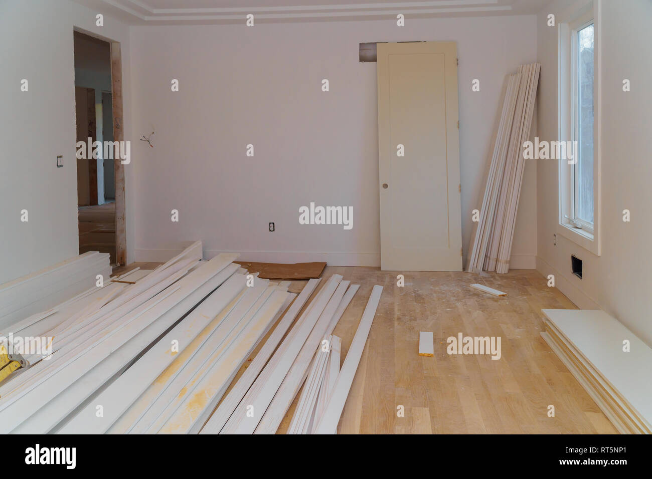 Interior construction of housing project with door and molding ...