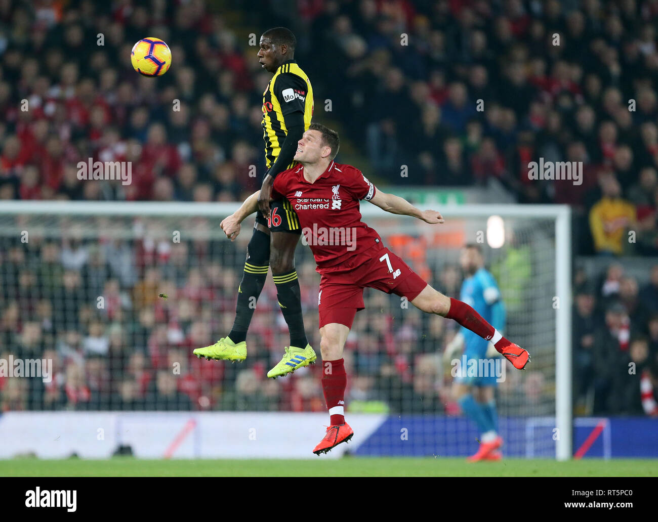 Watford's Abdoulaye Doucoure and Liverpool's James Milner battle for ...