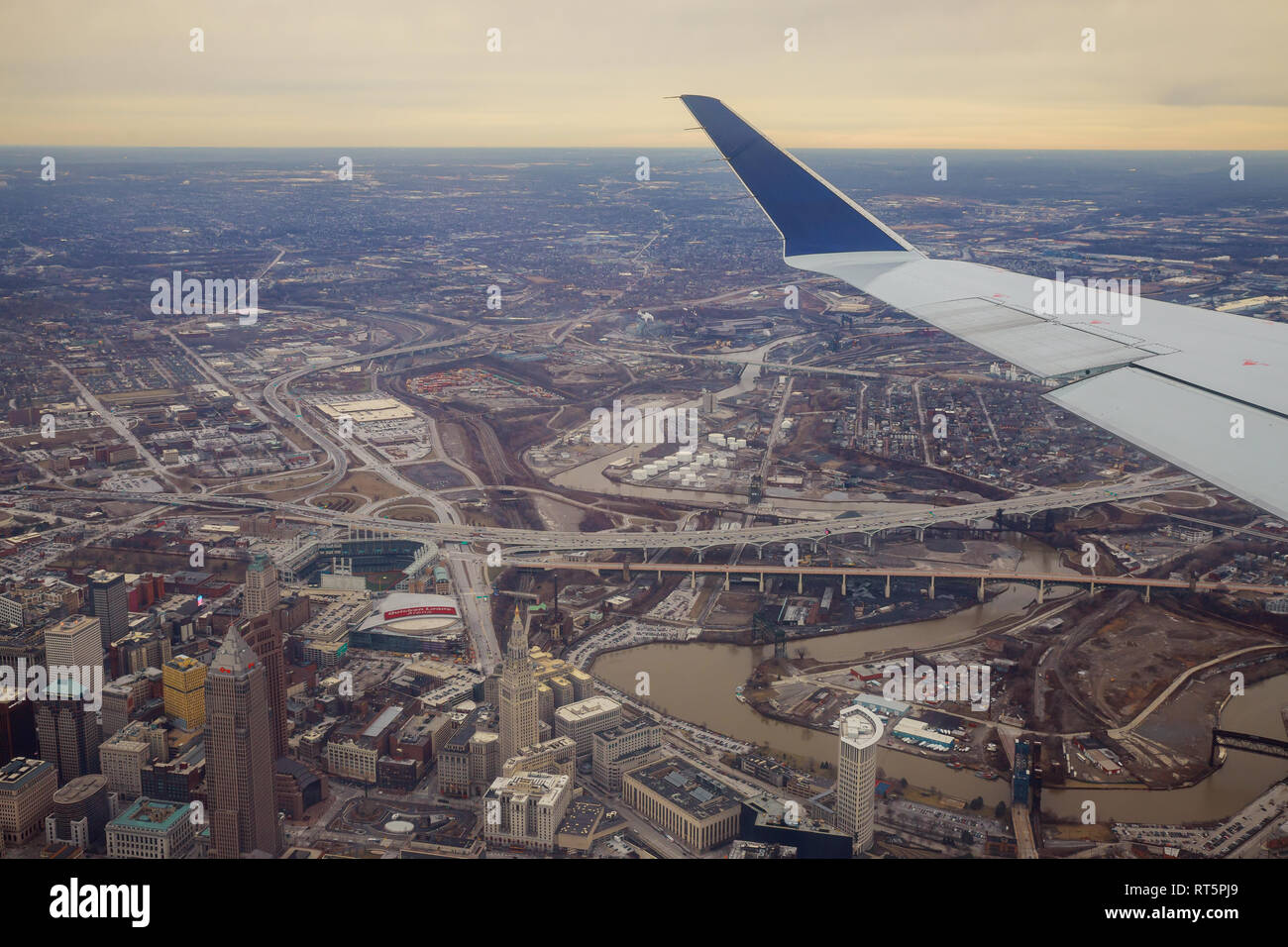 Panorama of Cleveland, Ohio from above with passenger plane going to ...