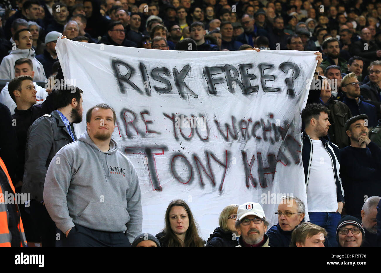 Fulham fans in the stands hold up a banner addresing Tony Khan during ...