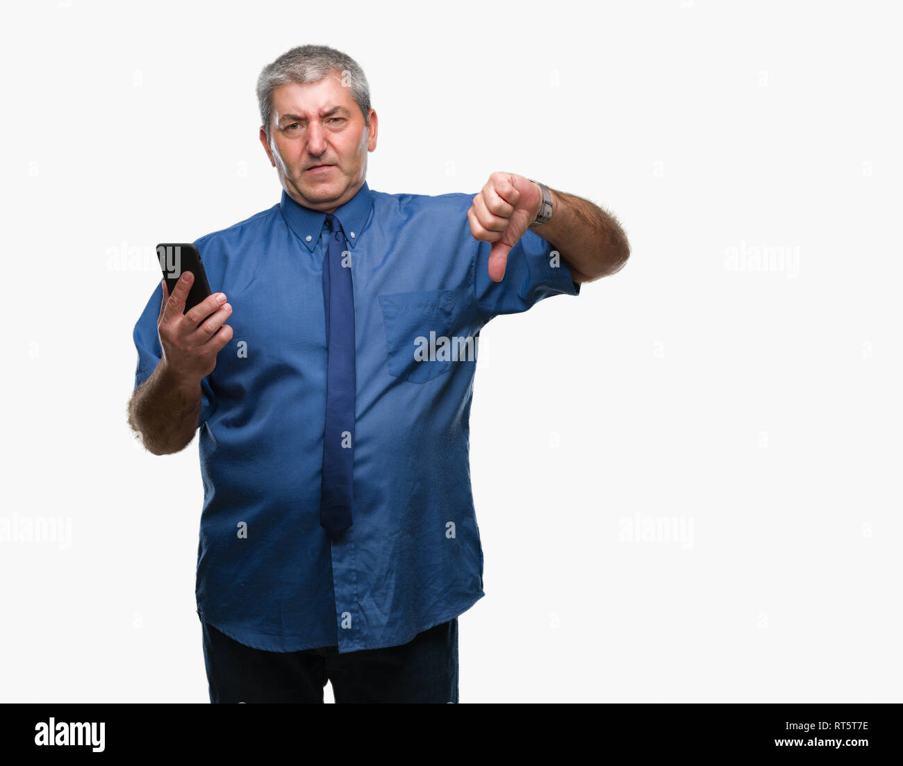 Handsome senior man texting sending message using smartphone over ...