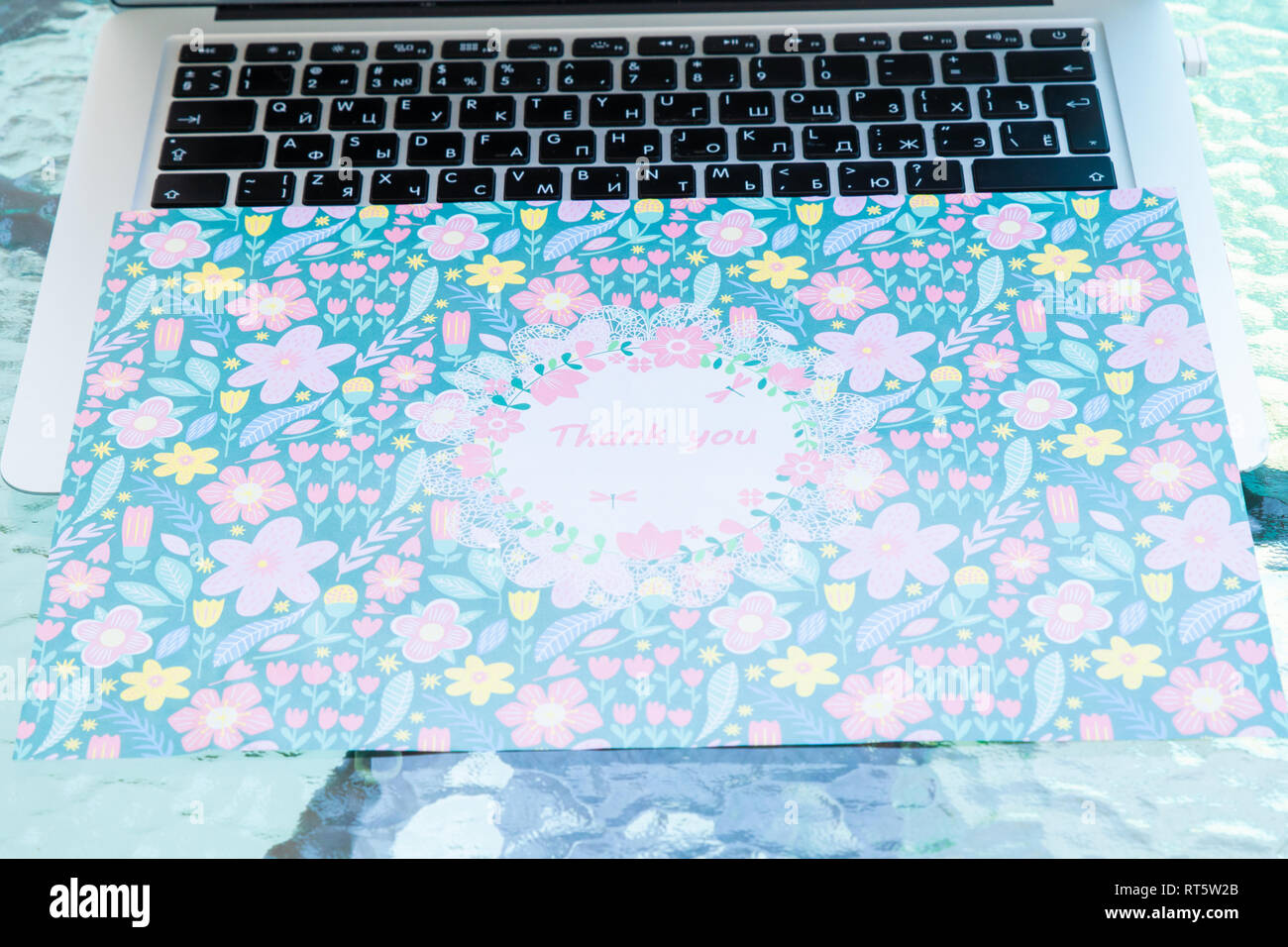 A thank you card sitting on a computer keyboard, online thank you Stock ...