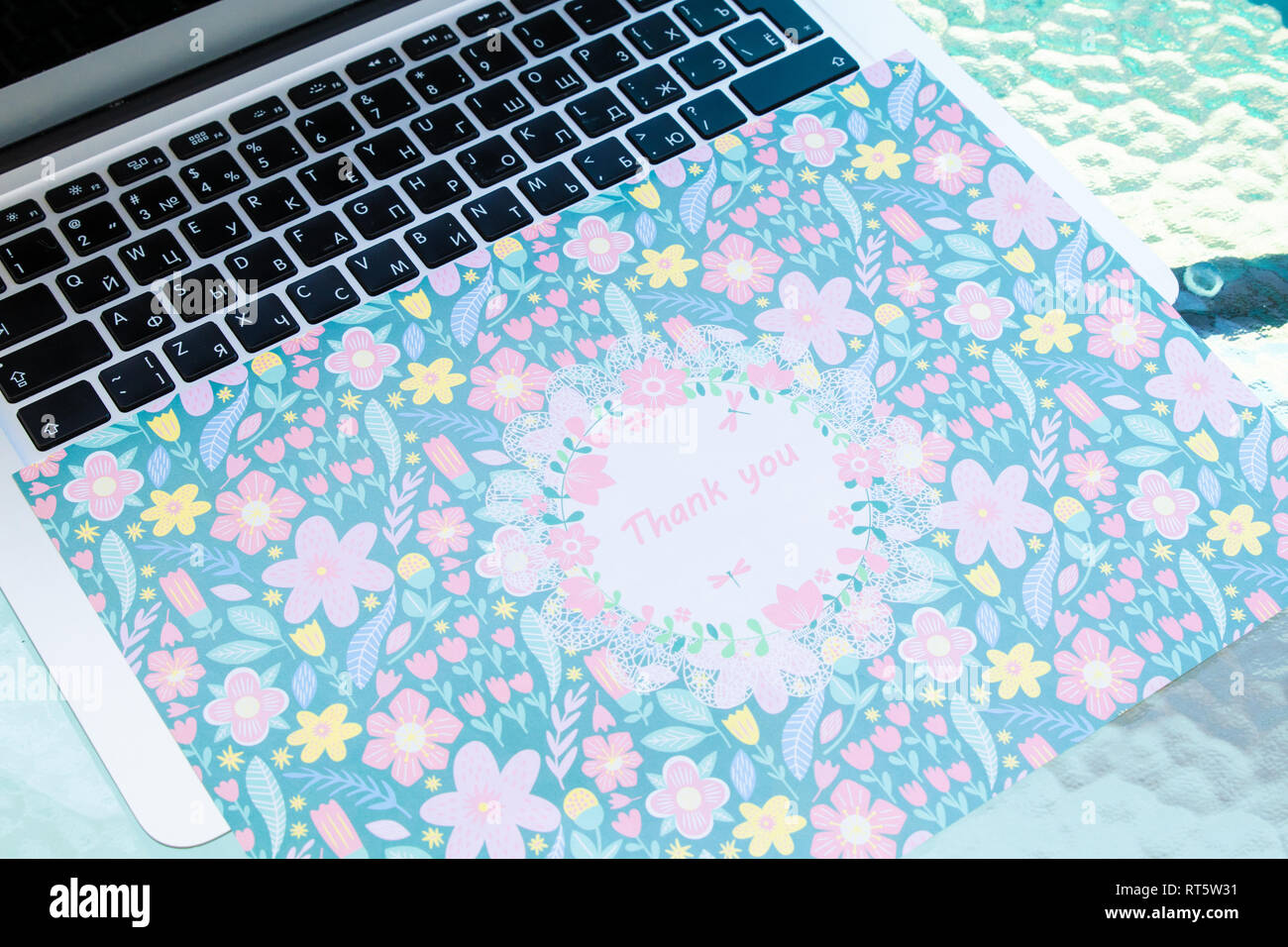 A thank you card sitting on a computer keyboard, online thank you Stock ...