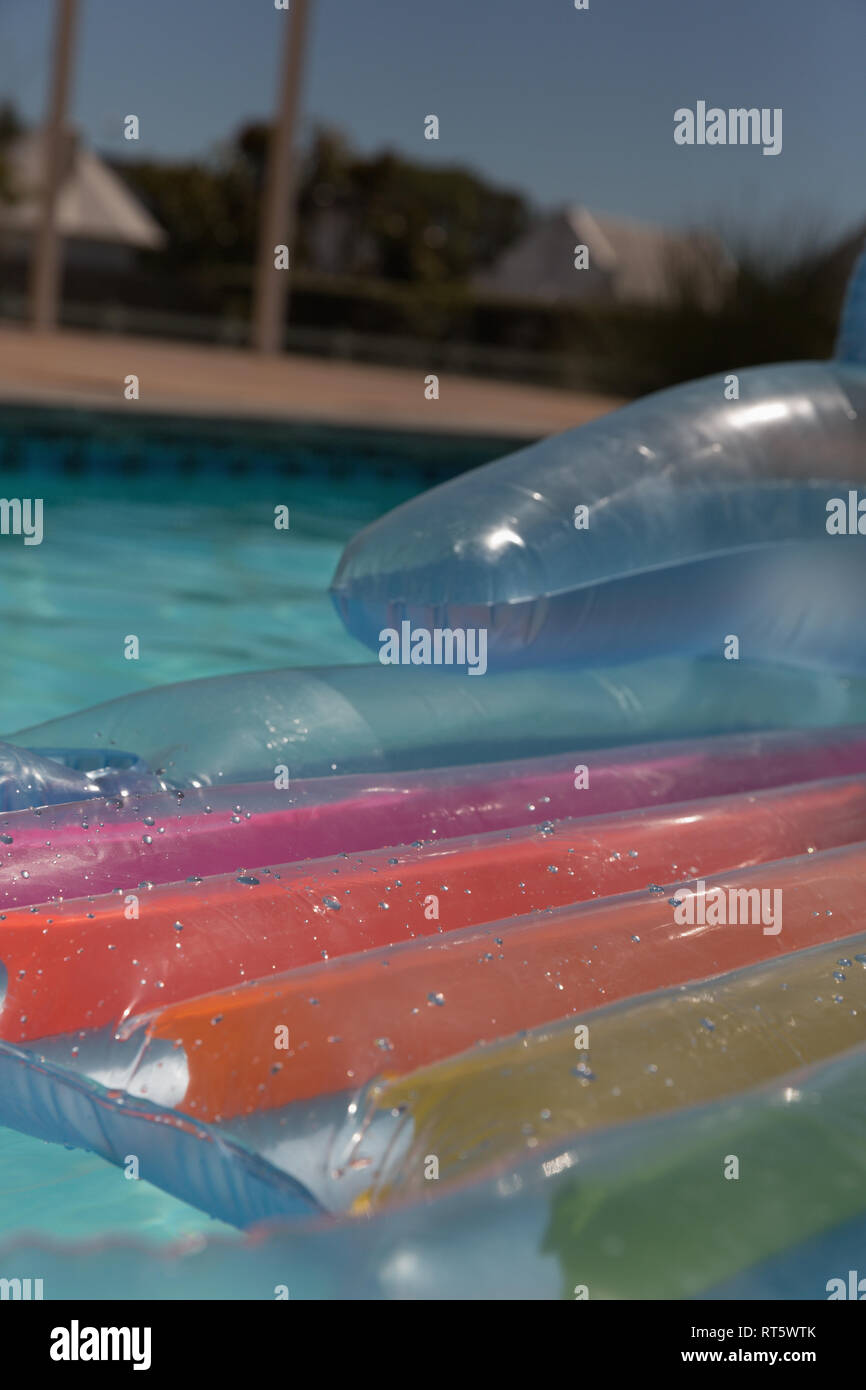 Inflatable tube floating in a swimming pool Stock Photo - Alamy