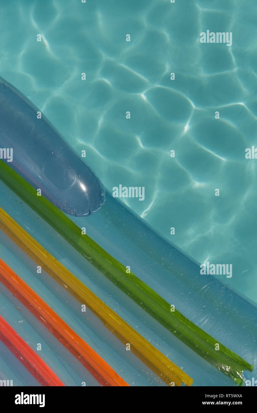 Inflatable tube floating in a swimming pool Stock Photo - Alamy