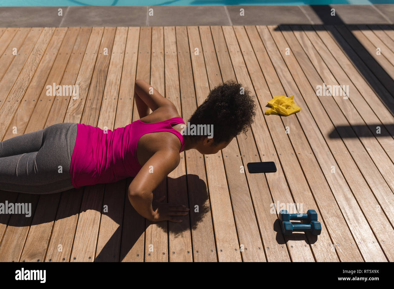 Woman performing push-up exercise in the backyard Stock Photo - Alamy