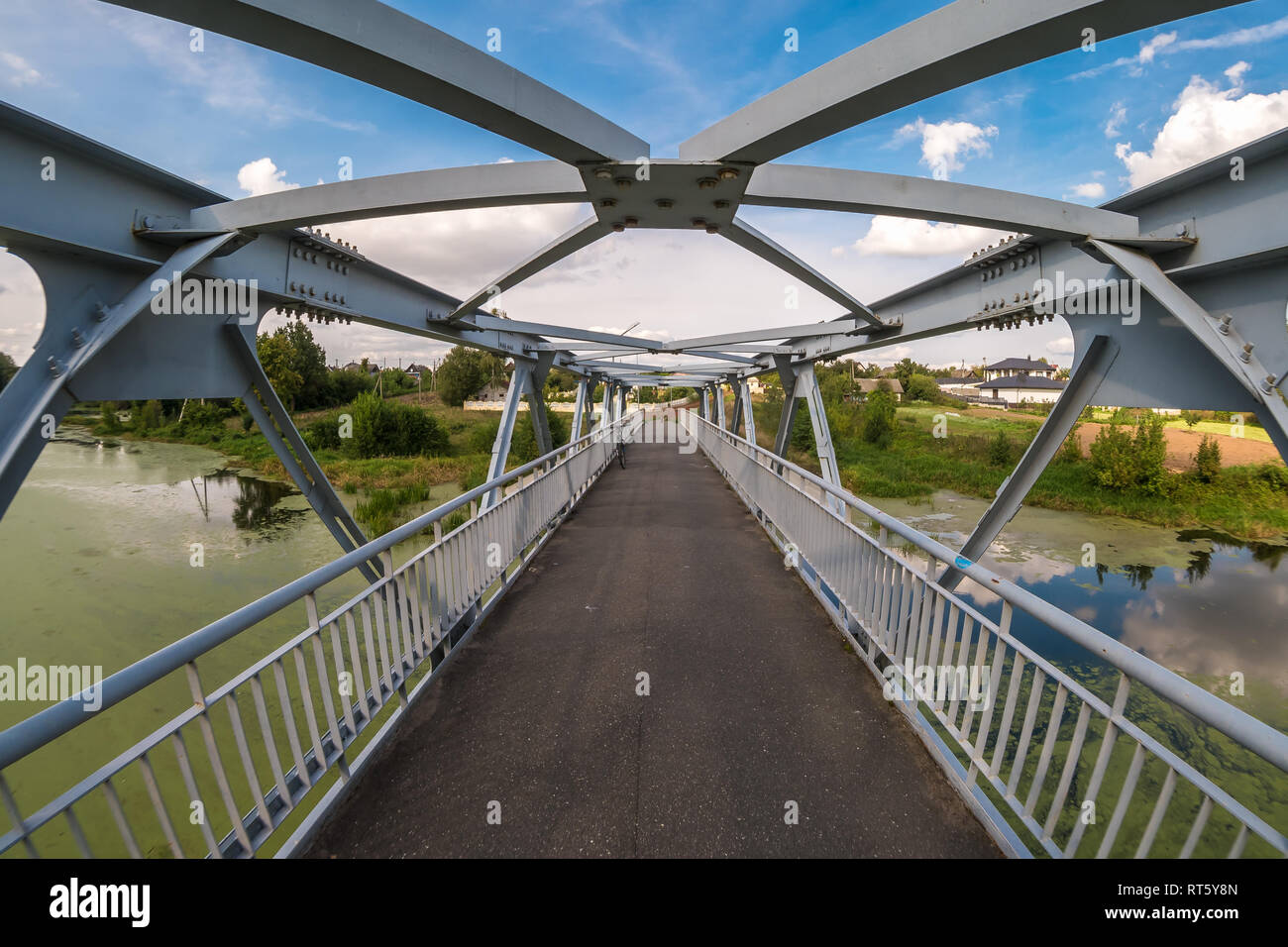 iron steel frame construction of pedestrian bridge across the river ...