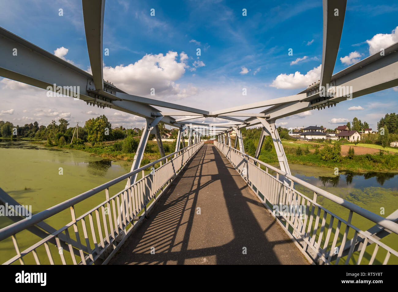 iron steel frame construction of pedestrian bridge across the river ...