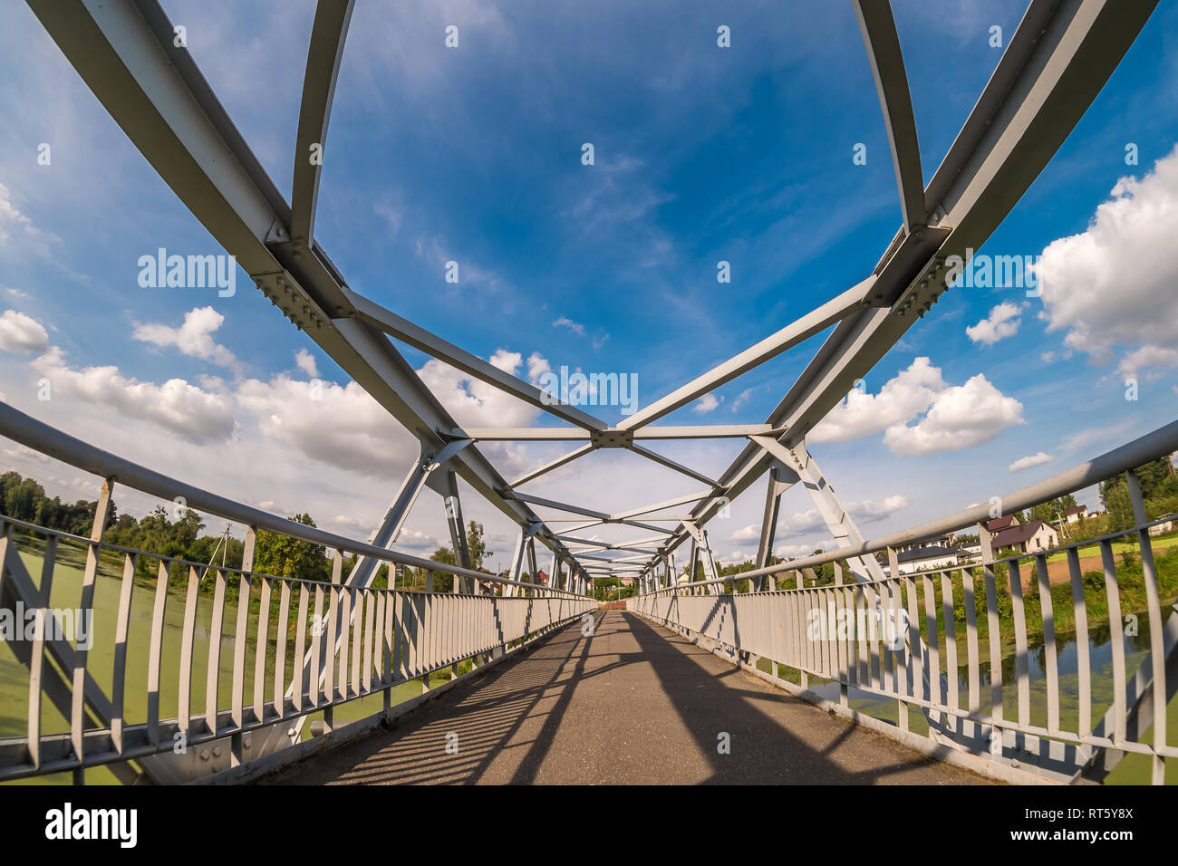 iron steel frame construction of pedestrian bridge across the river ...