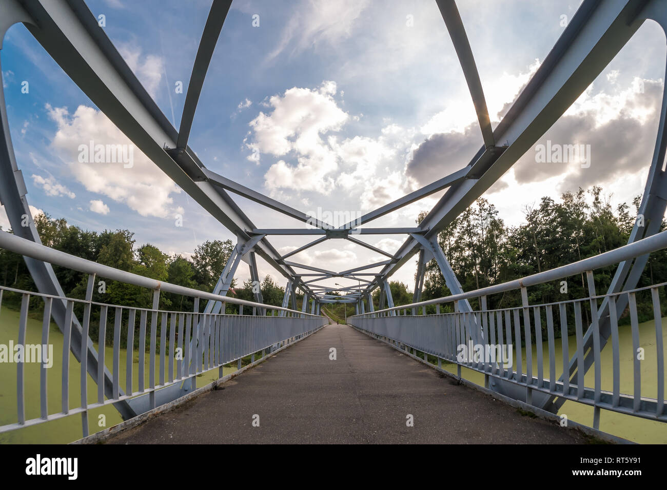iron steel frame construction of pedestrian bridge across the river ...