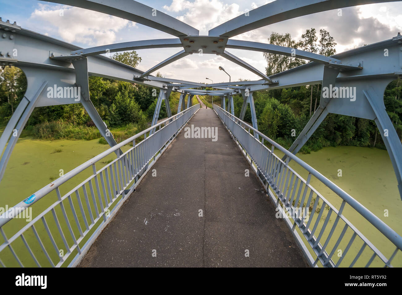 iron steel frame construction of pedestrian bridge across the river ...