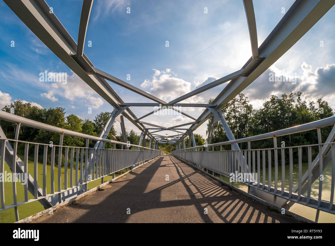 iron steel frame construction of pedestrian bridge across the river ...
