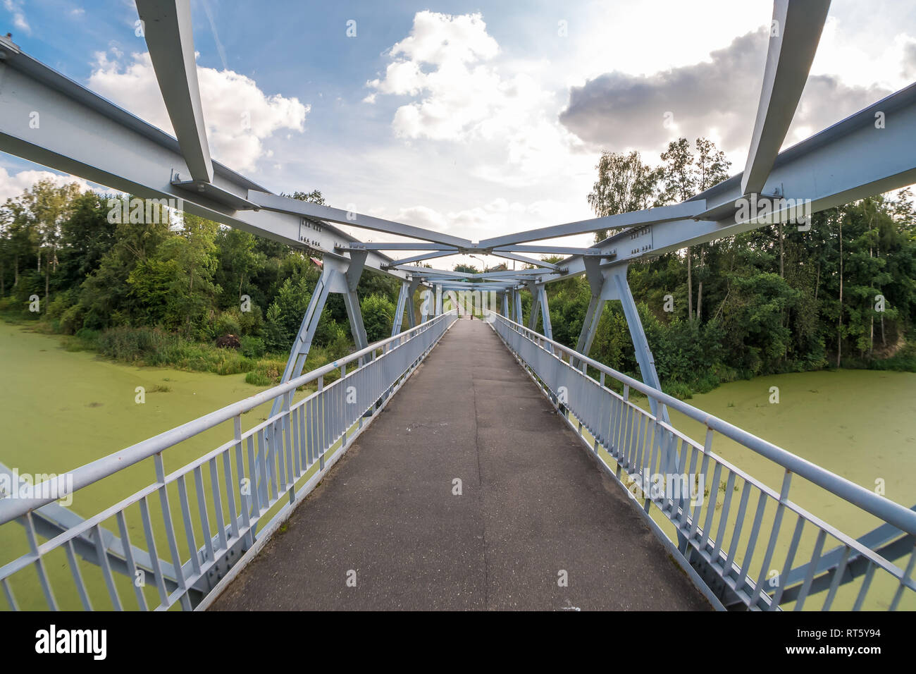 iron steel frame construction of pedestrian bridge across the river ...