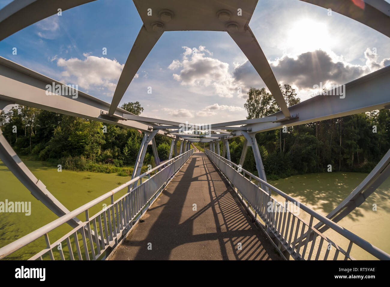 iron steel frame construction of pedestrian bridge across the river ...