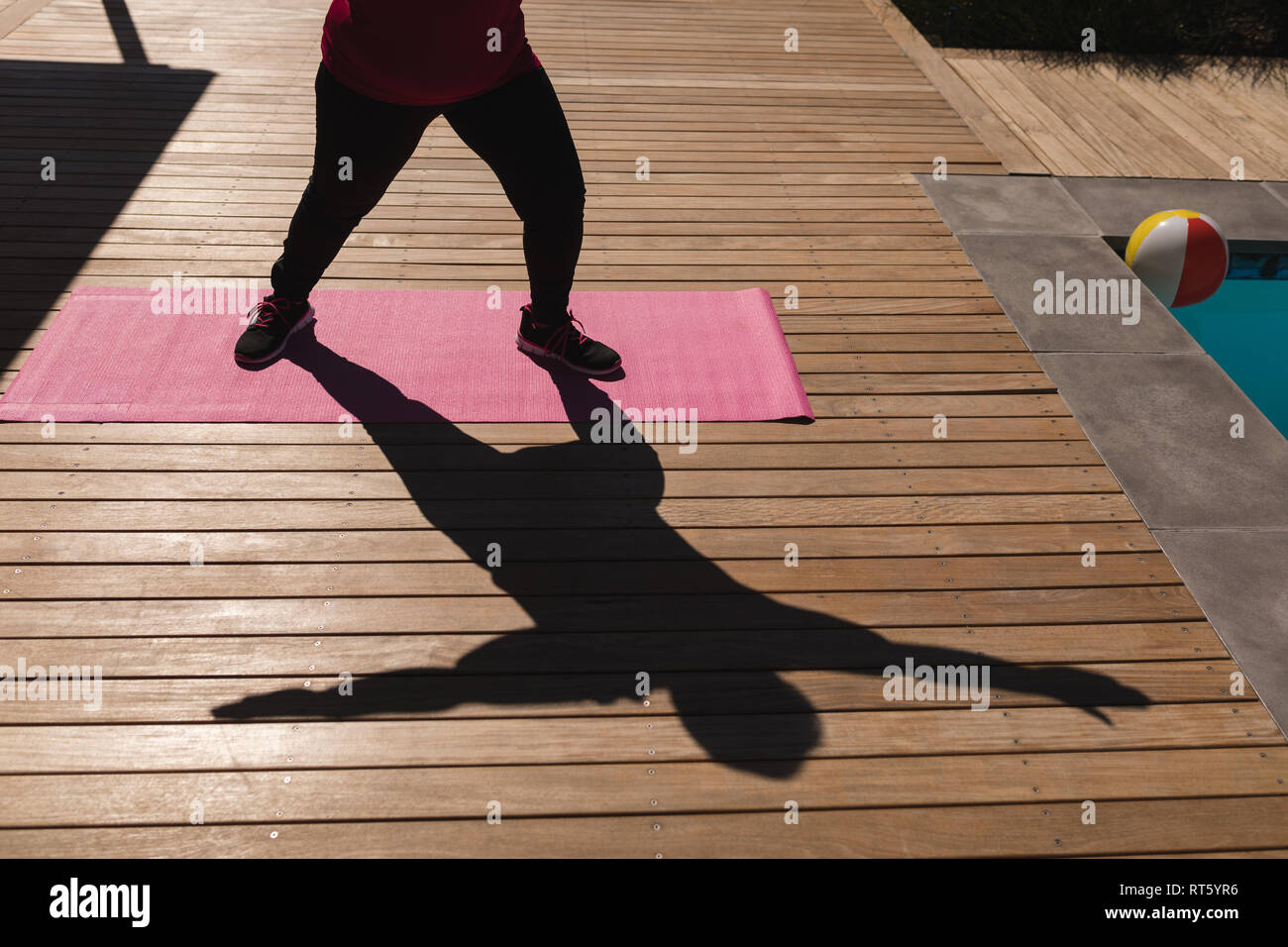 Shadow of a senior woman performing stretching exercise Stock Photo - Alamy