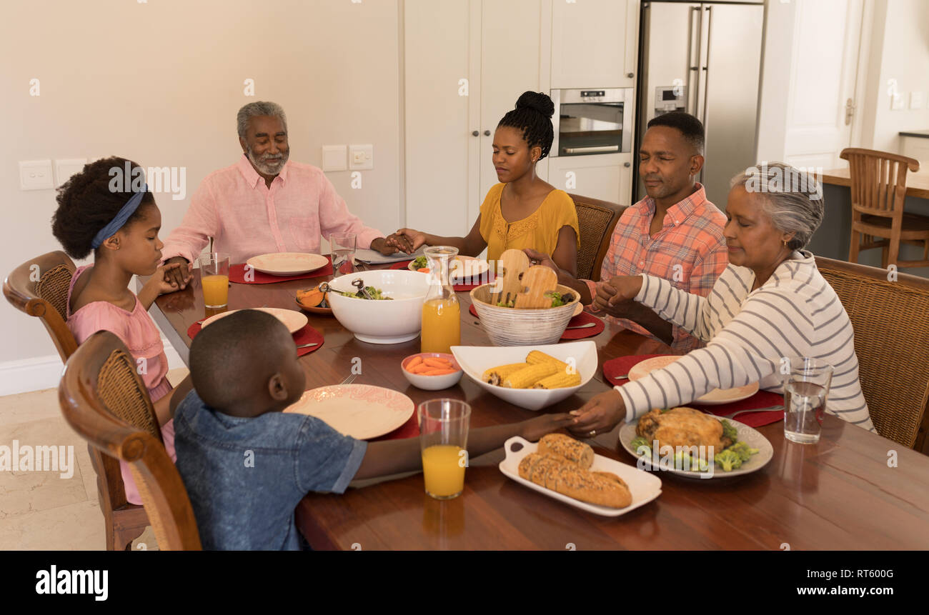 Family praying together hi-res stock photography and images - Alamy