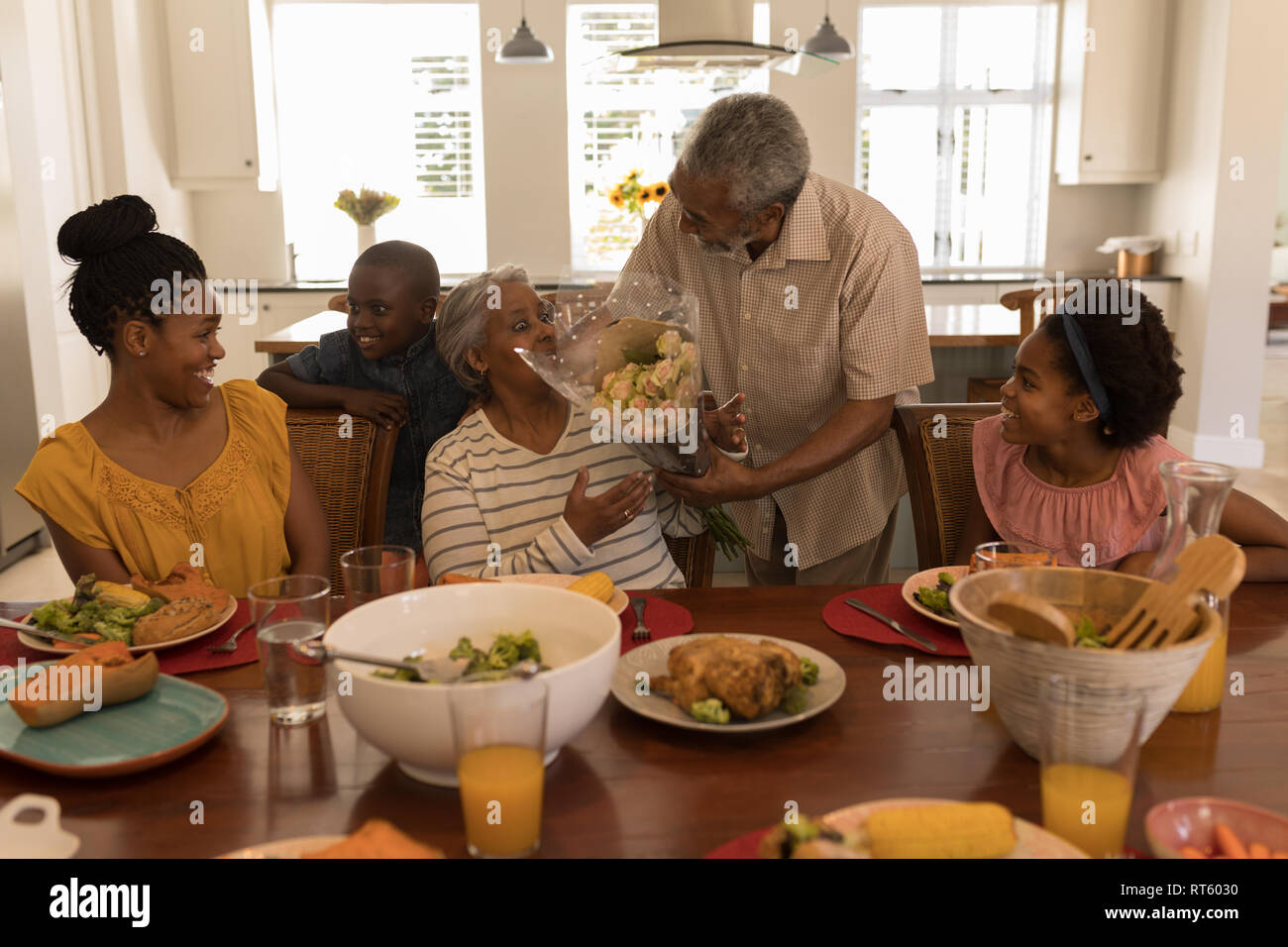 Granny giving food granddad hi-res stock photography and images - Alamy