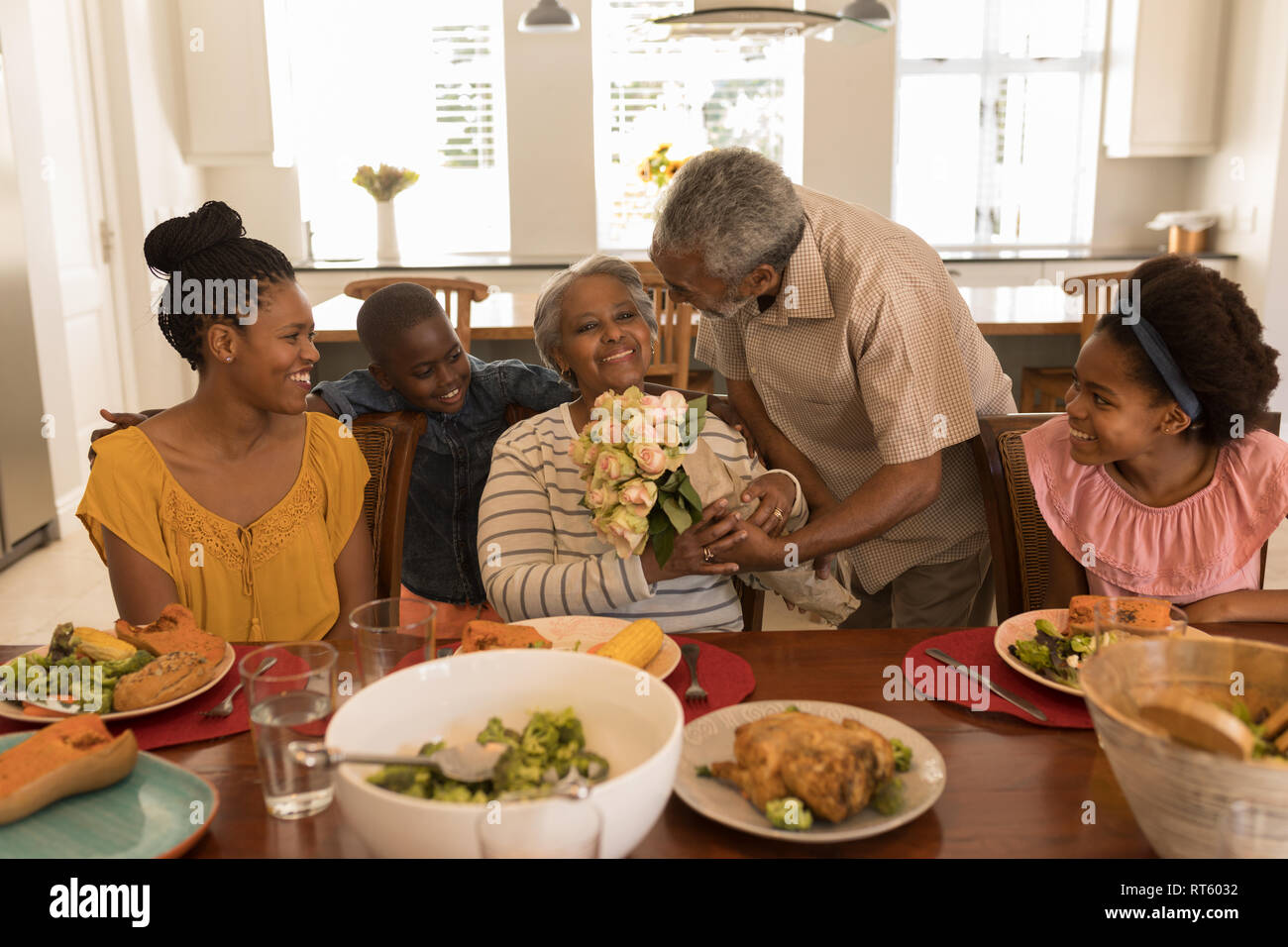 Granny giving food granddad hi-res stock photography and images - Alamy