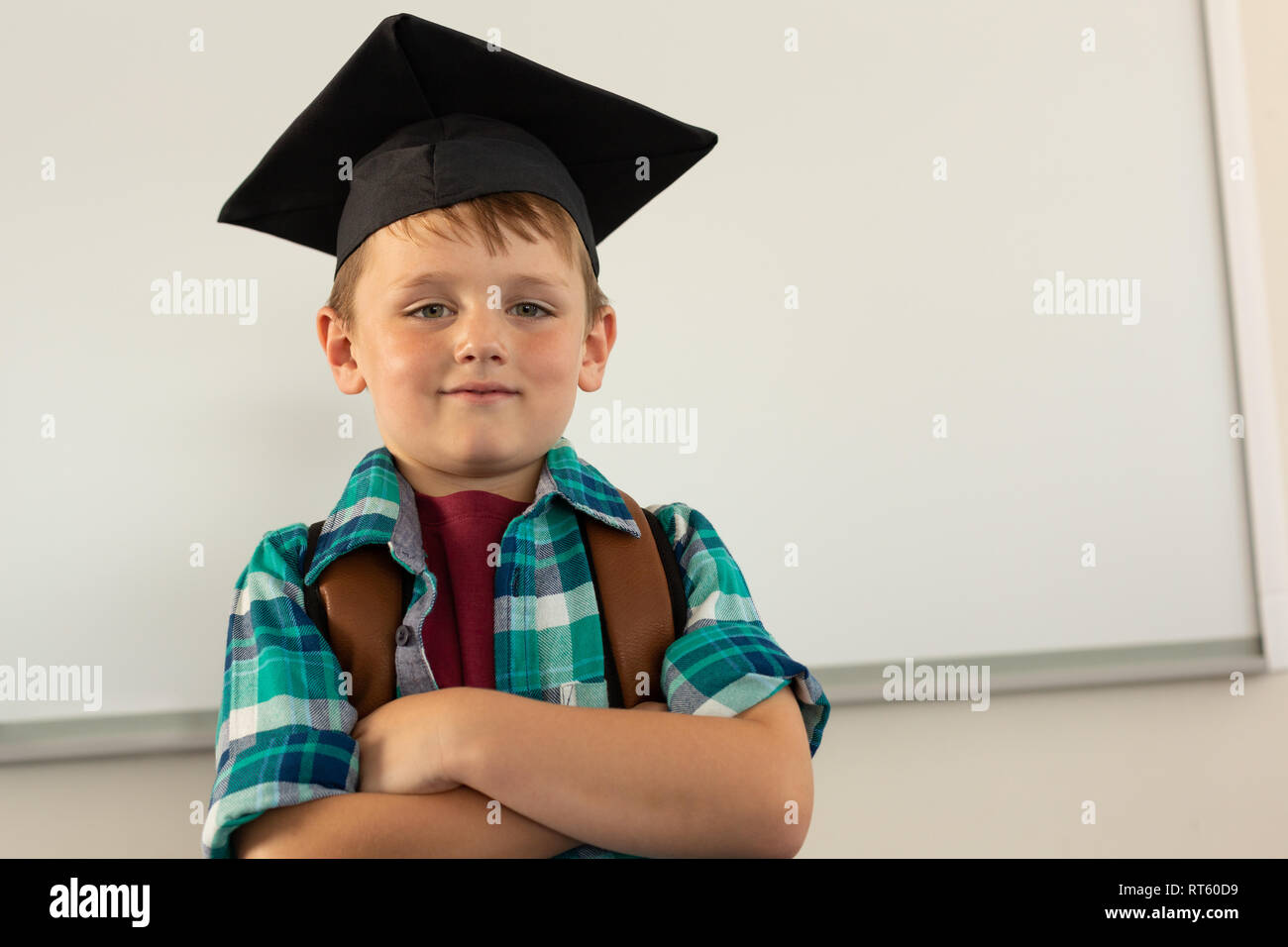 School boy wearing graduation cap hi-res stock photography and images ...