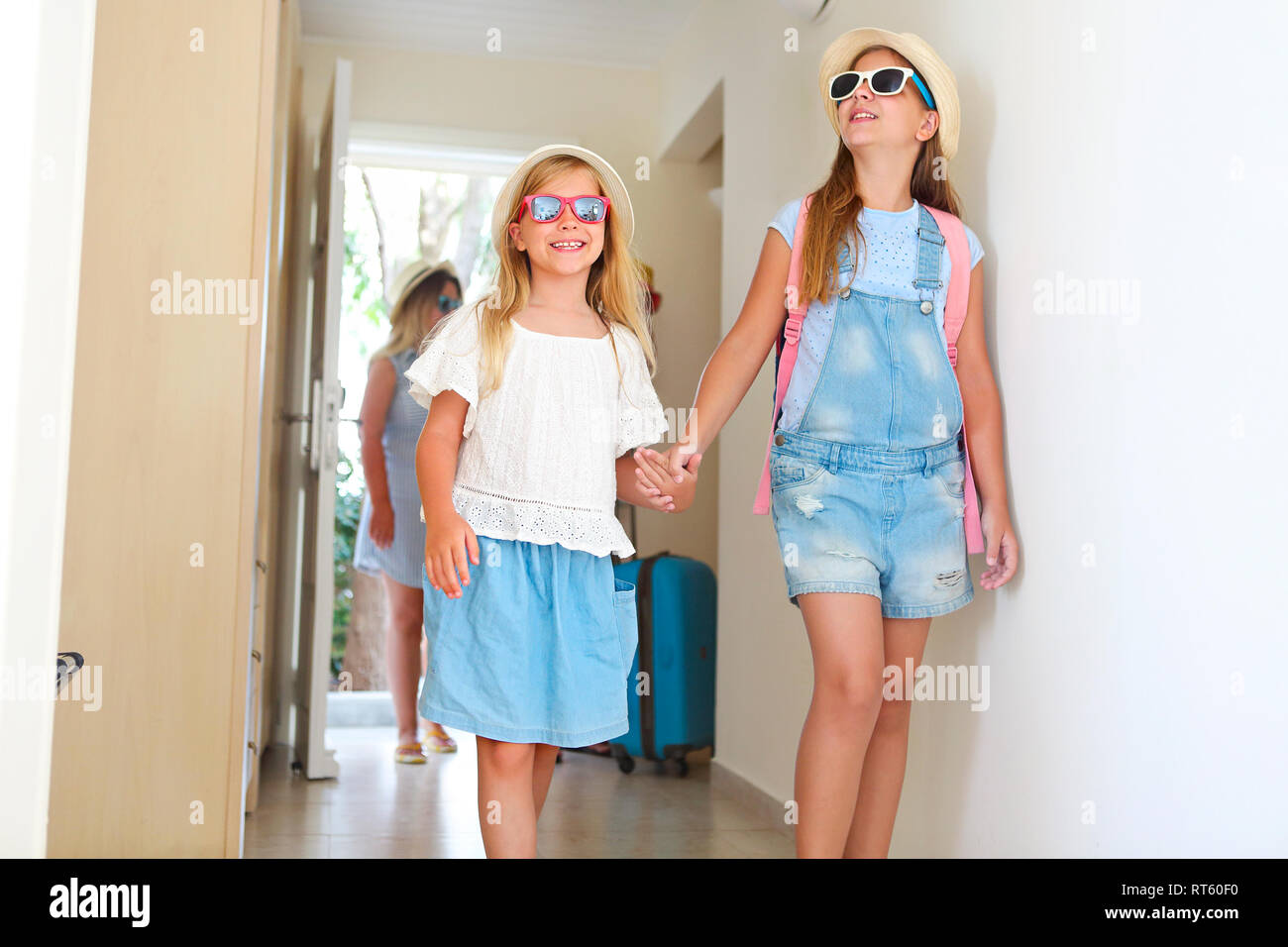 Young family with three kids with luggage in hotel room Stock Photo - Alamy