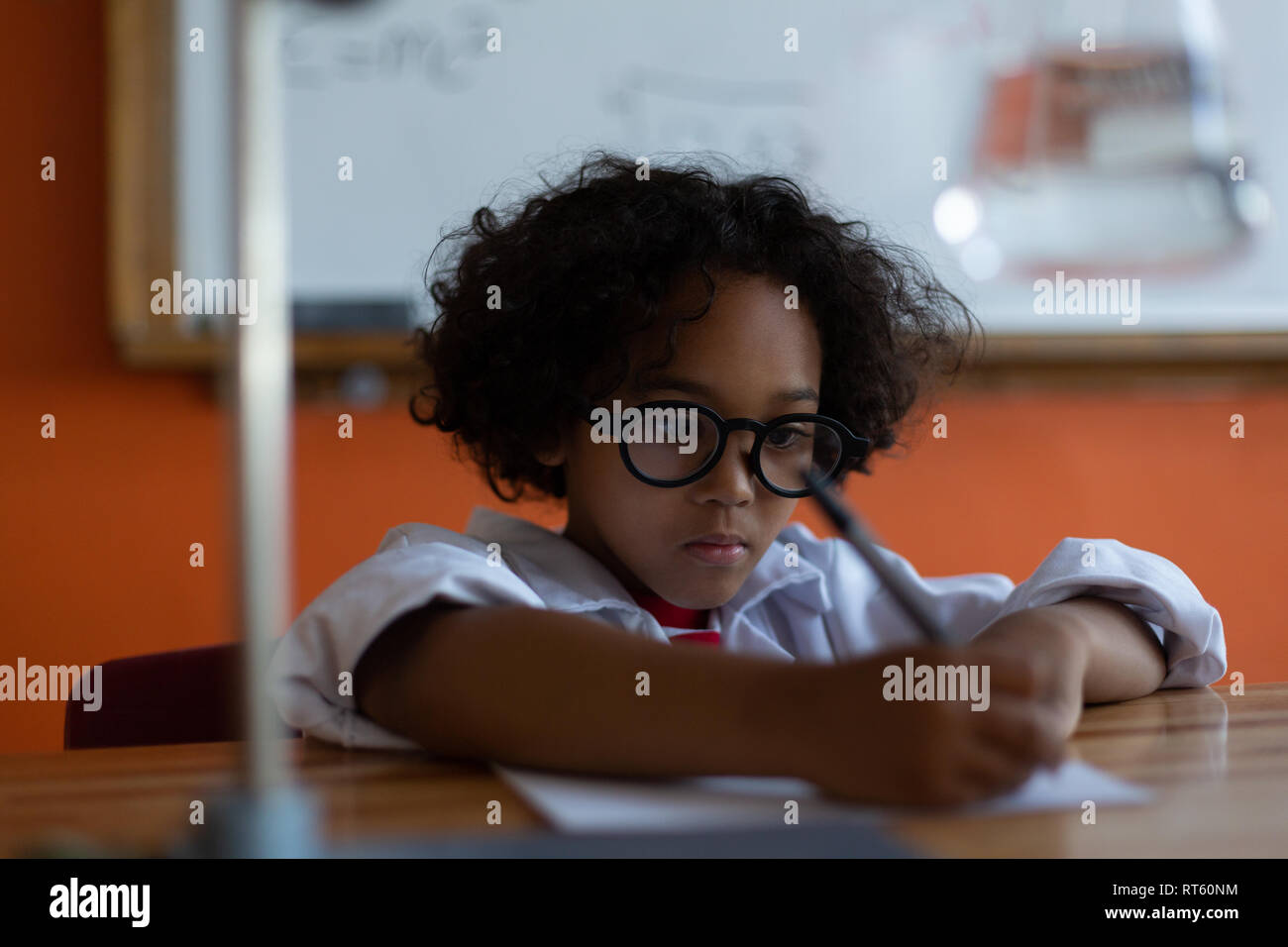 Student writing paper desk hi-res stock photography and images - Alamy