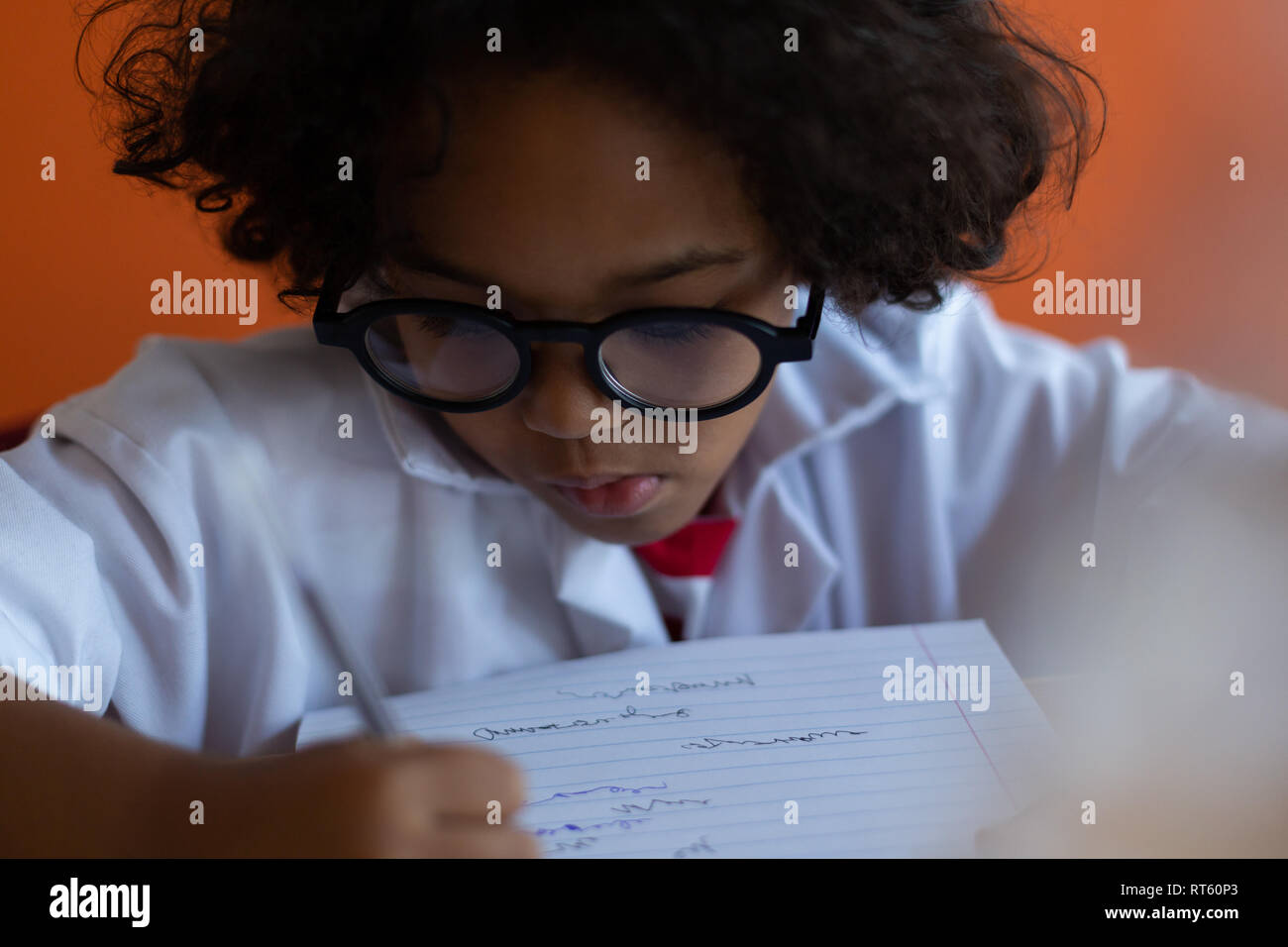 Student writing paper desk hi-res stock photography and images - Alamy